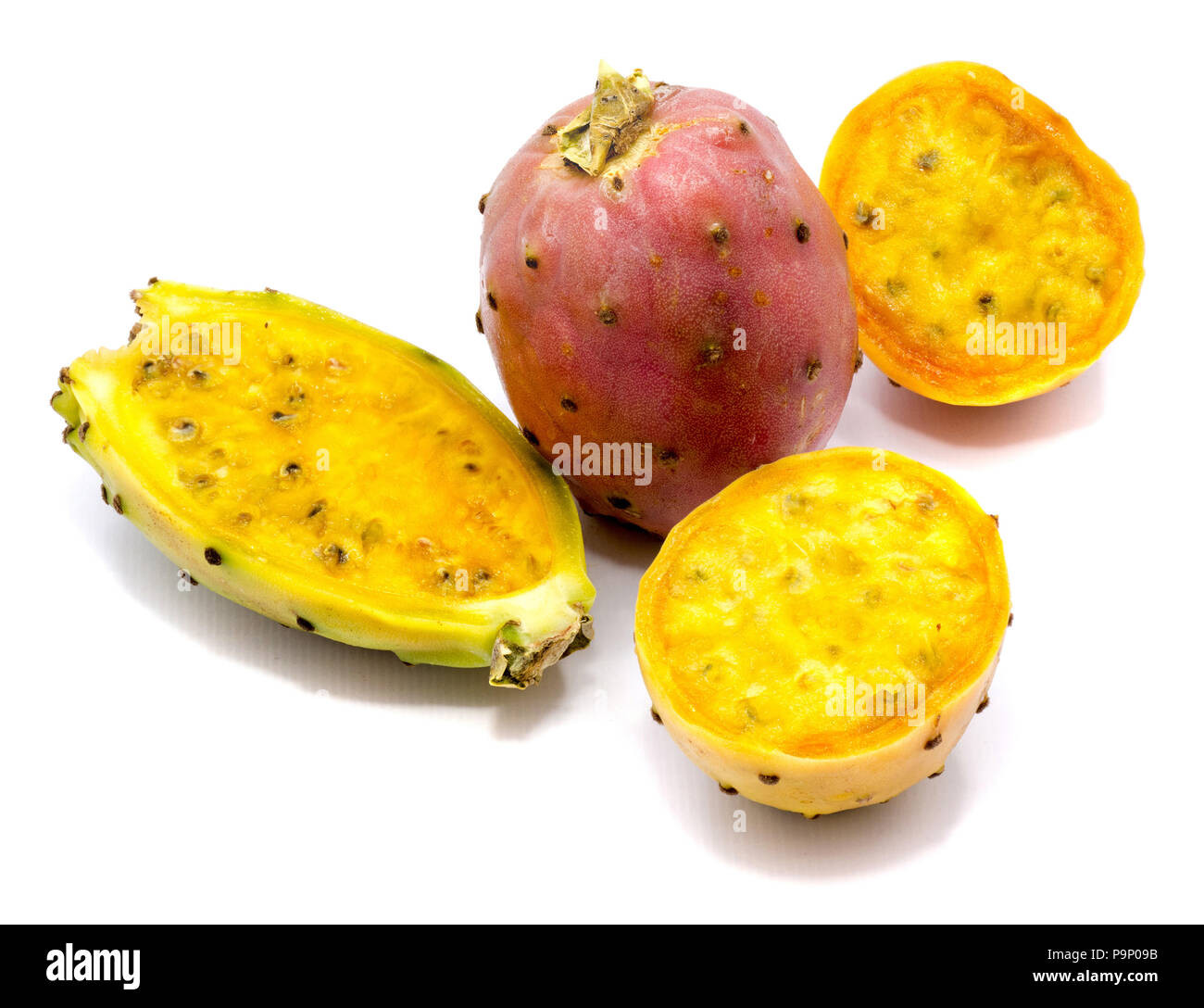 Sliced one whole pink and prickly pear halves, isolated on white ...