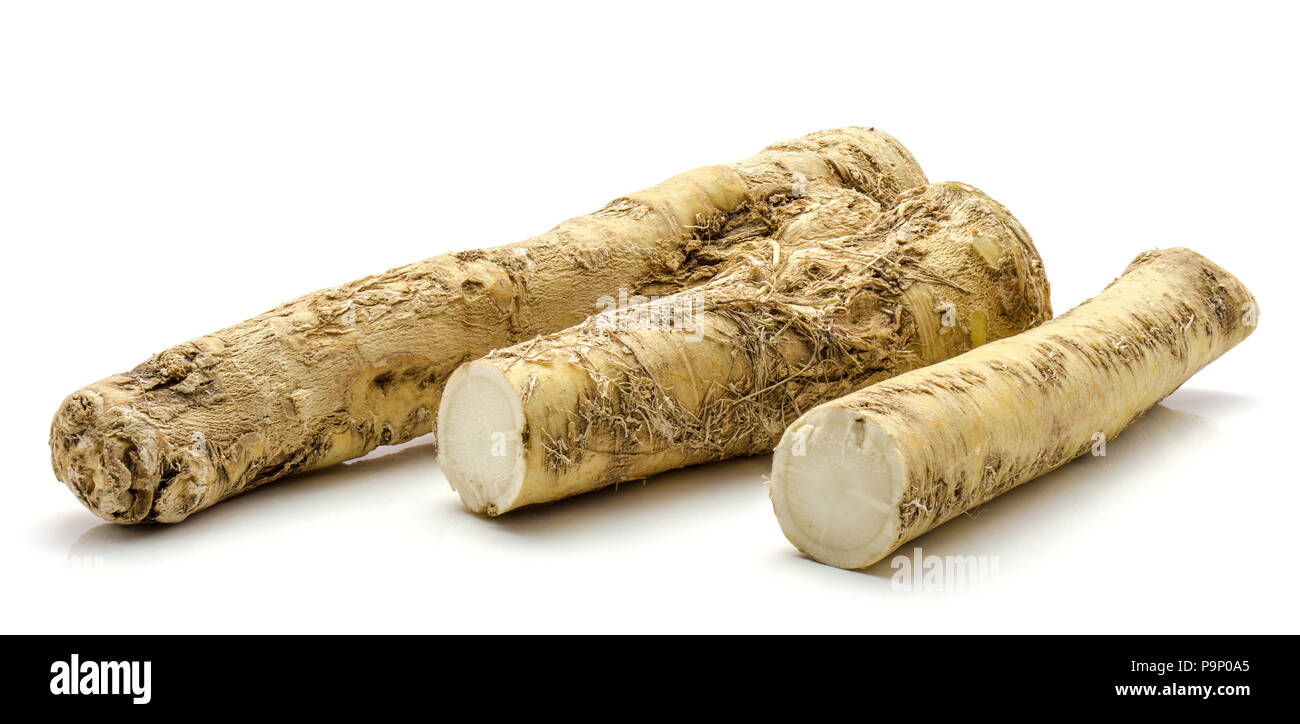 Fresh horseradish root isolated on white background one whole and two ...