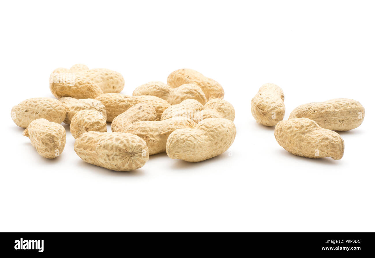 Unshelled peanuts stack isolated on white background raw Stock Photo ...