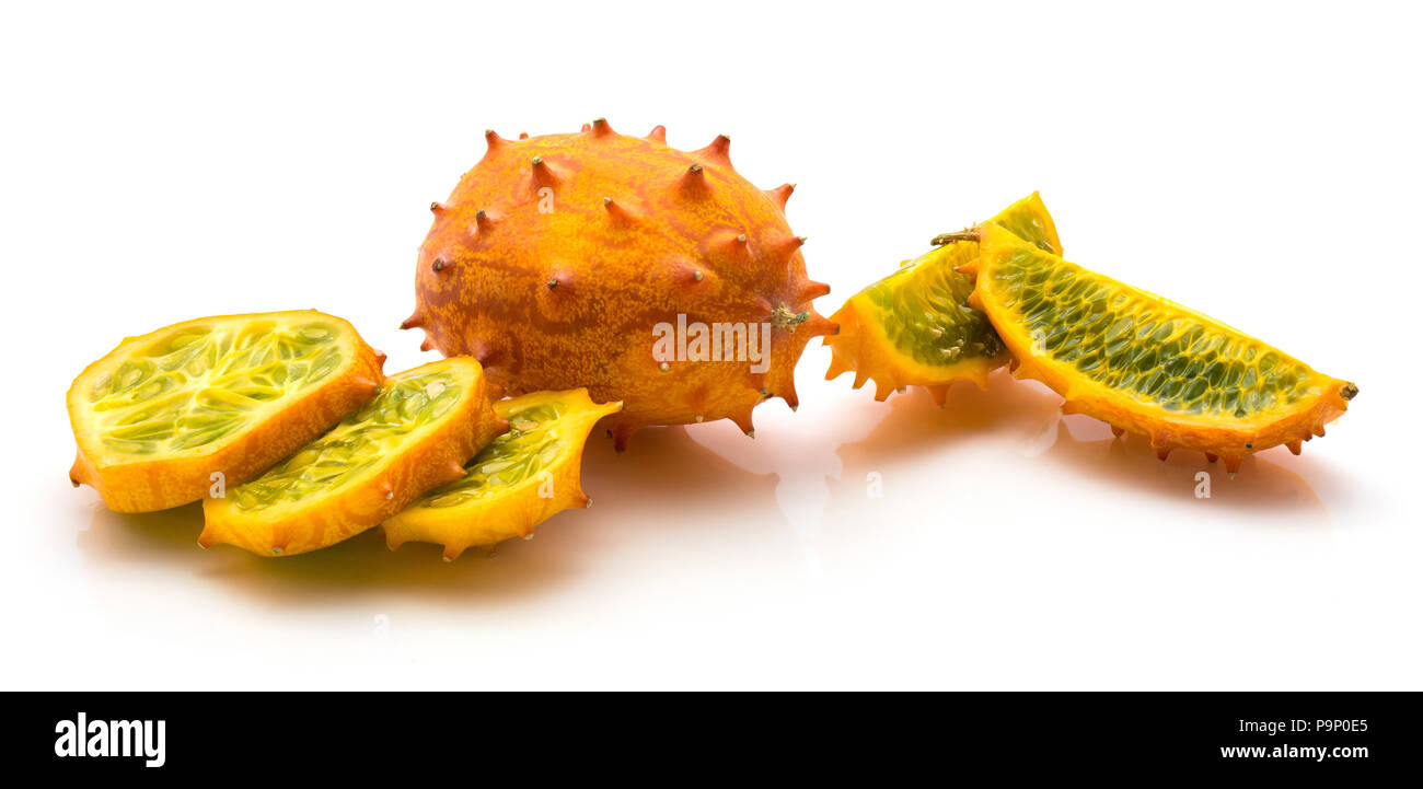 Sliced kiwano isolated on white background one whole two quarters three ...