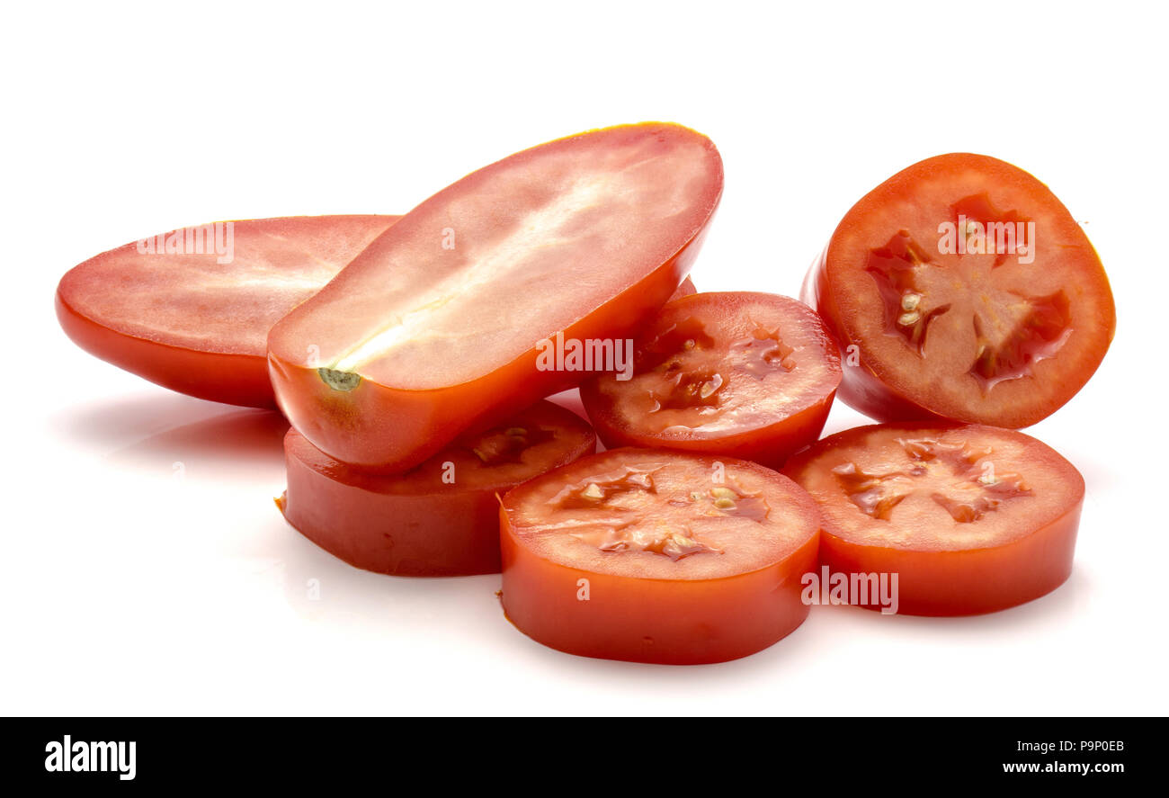 Sliced San Marzano tomato rings and two halves isolated on white ...