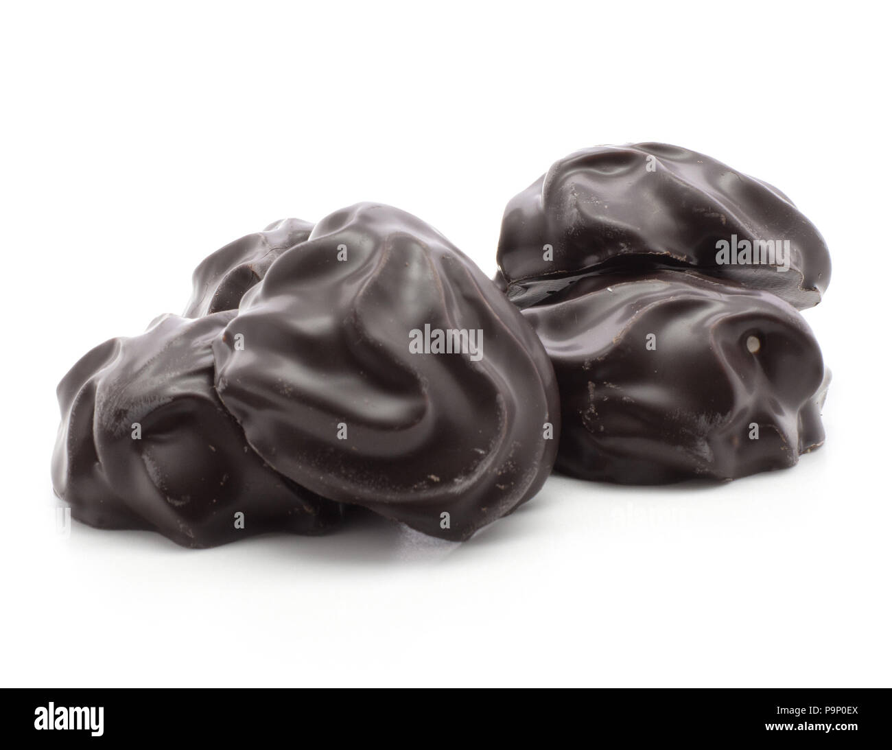 Four dark chocolate-coated zefir isolated on white background Stock ...