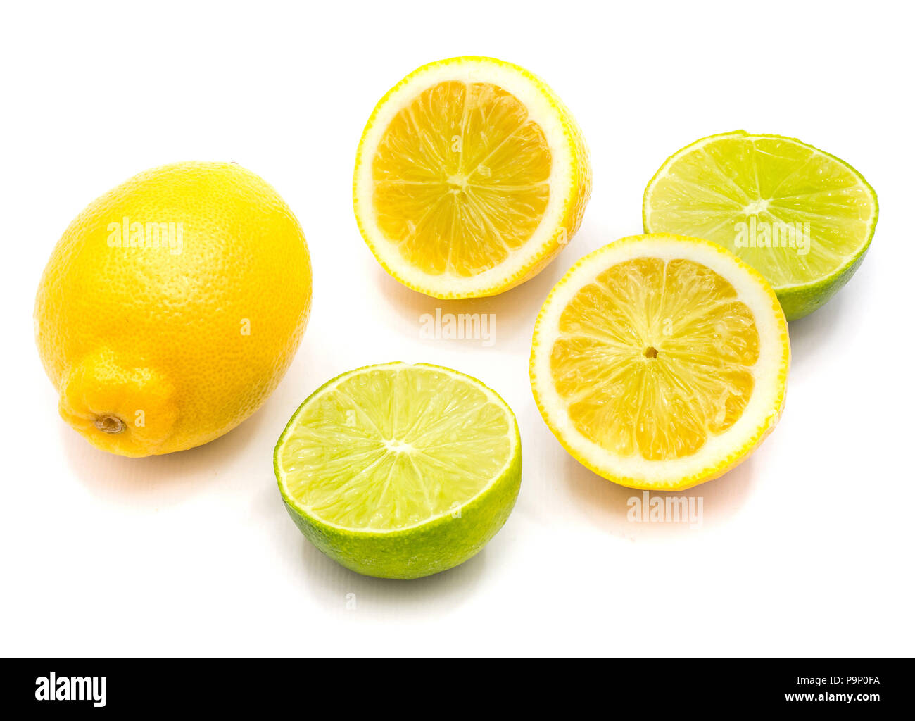 One whole lemon, two lemon and lime halves isolated on white background ...