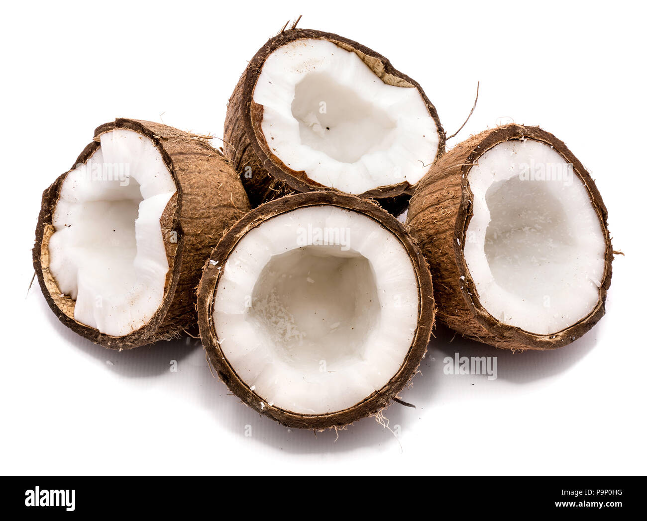 Four cracked coconut halves isolated on white background Stock Photo ...