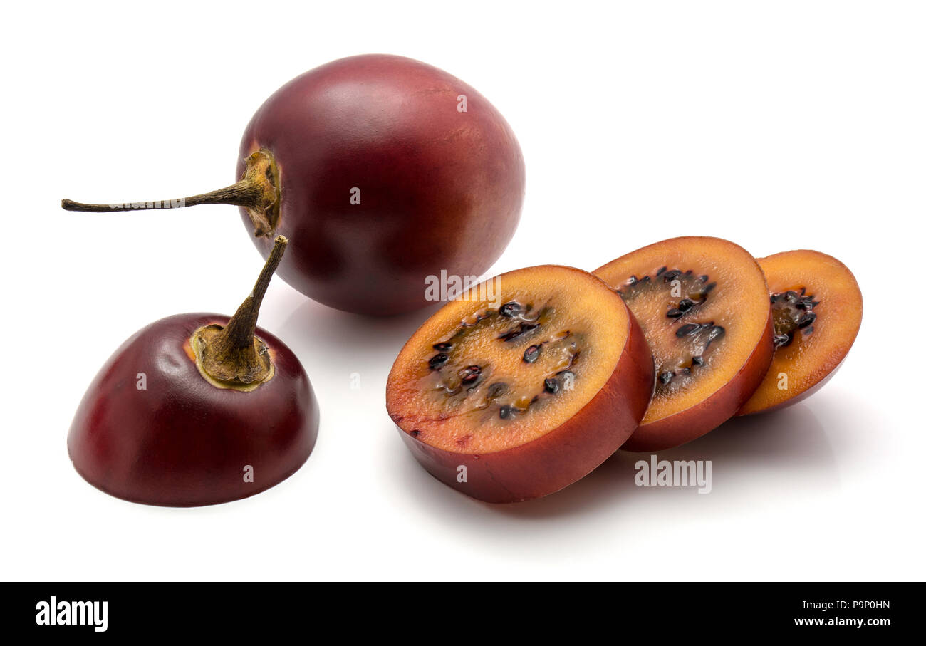 Sliced tamarillo isolated on white background one whole and slices ...