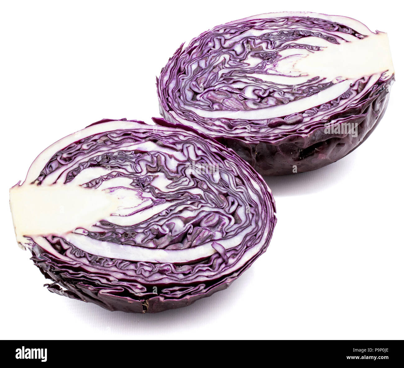 Two sliced halves of one whole purple cabbage isolated on white ...
