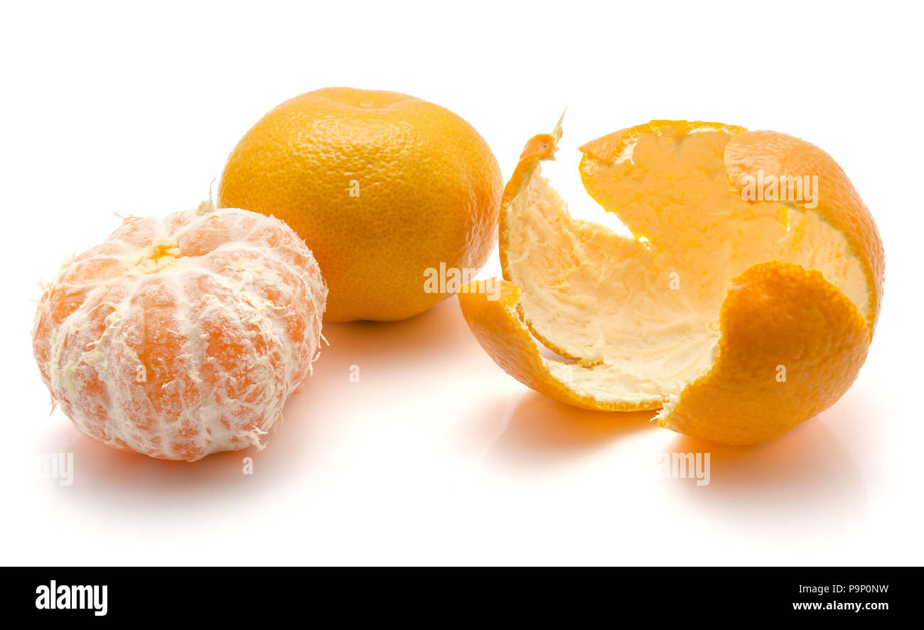 Peeled tangerine with separated rind and one whole isolated on white ...