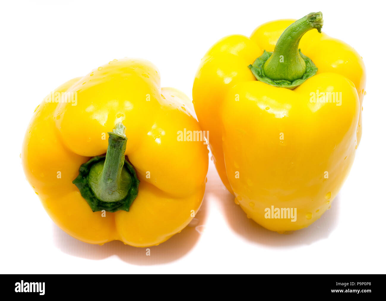 Group of yellow peppers on back, isolated on white background Stock ...