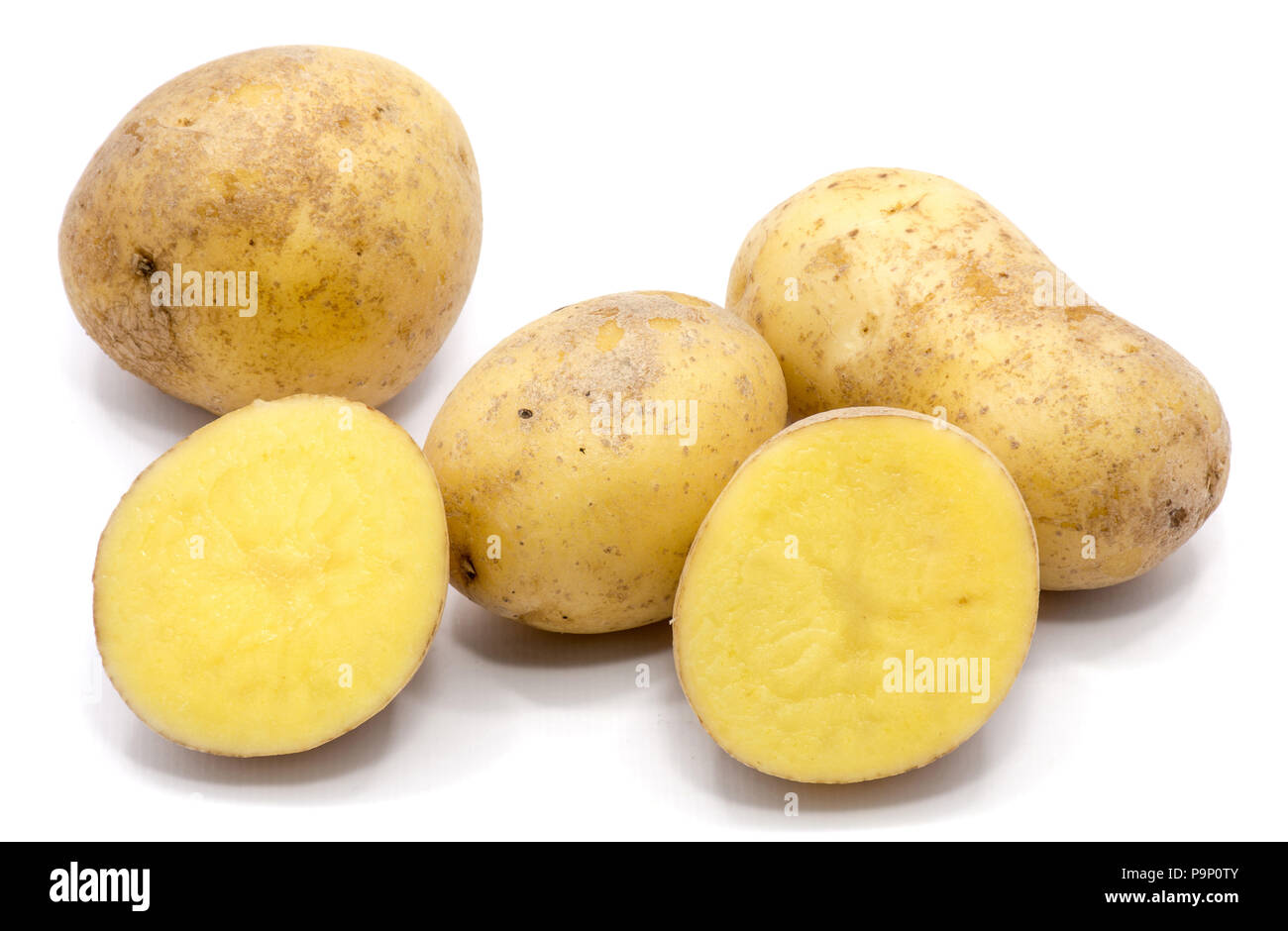 Group of whole potatoes and two halves isolated on white background ...