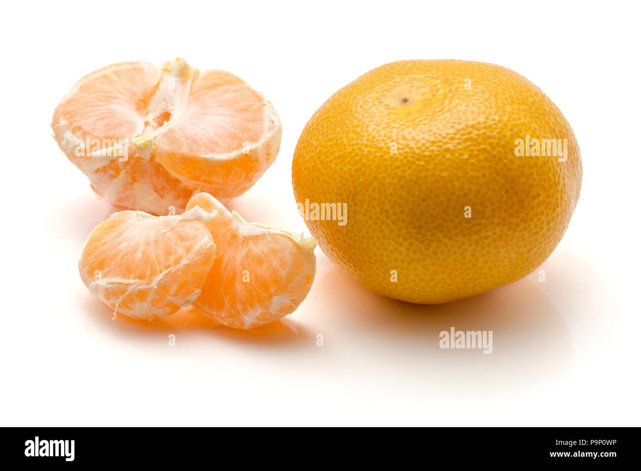 Tangerine isolated on white background one whole one peeled half two ...