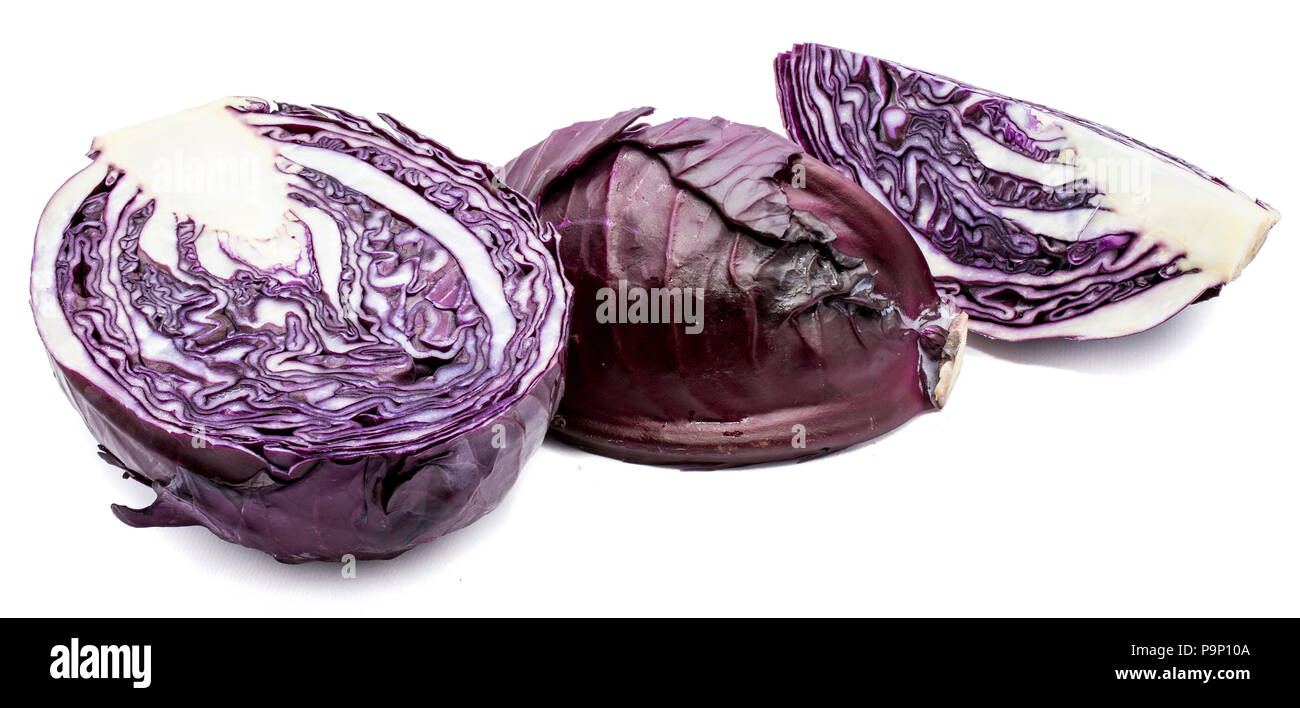 Two sliced quarters of purple cabbage and one half isolated on white ...