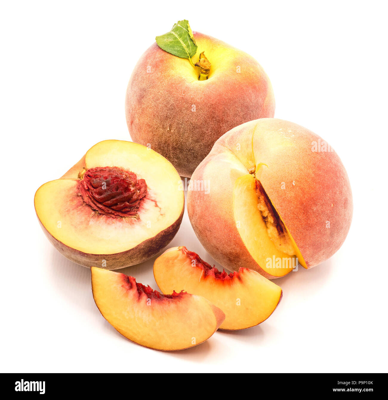 Peaches, one whole, one half and cut open, two slices, isolated on ...