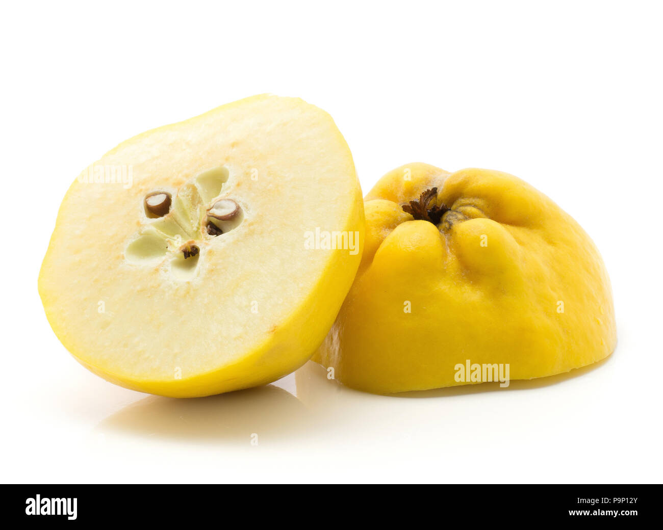 Sliced quince halves isolated on white background raw yellow cut in ...
