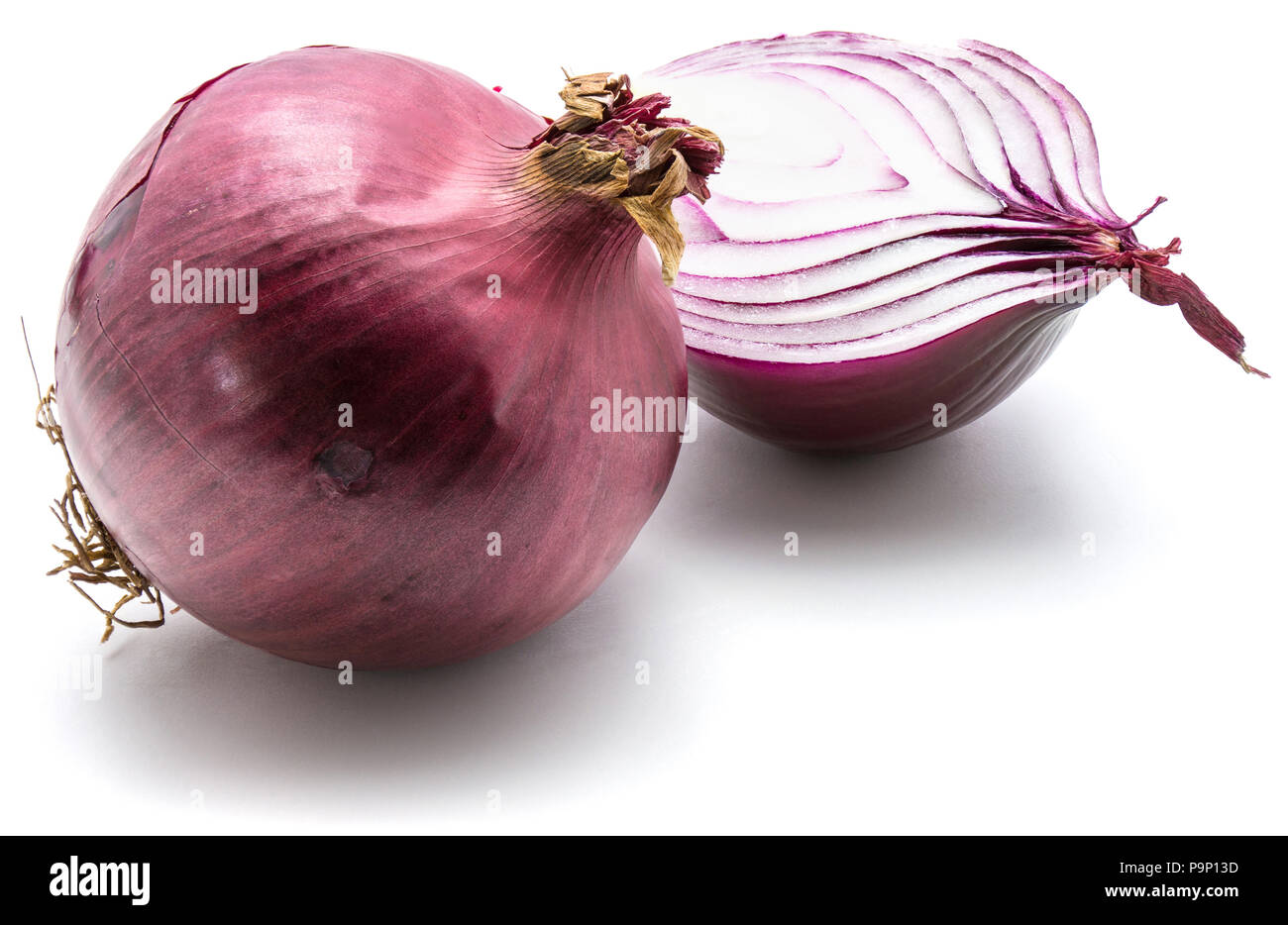 One whole red onion bulb and a half isolated on white background Stock ...