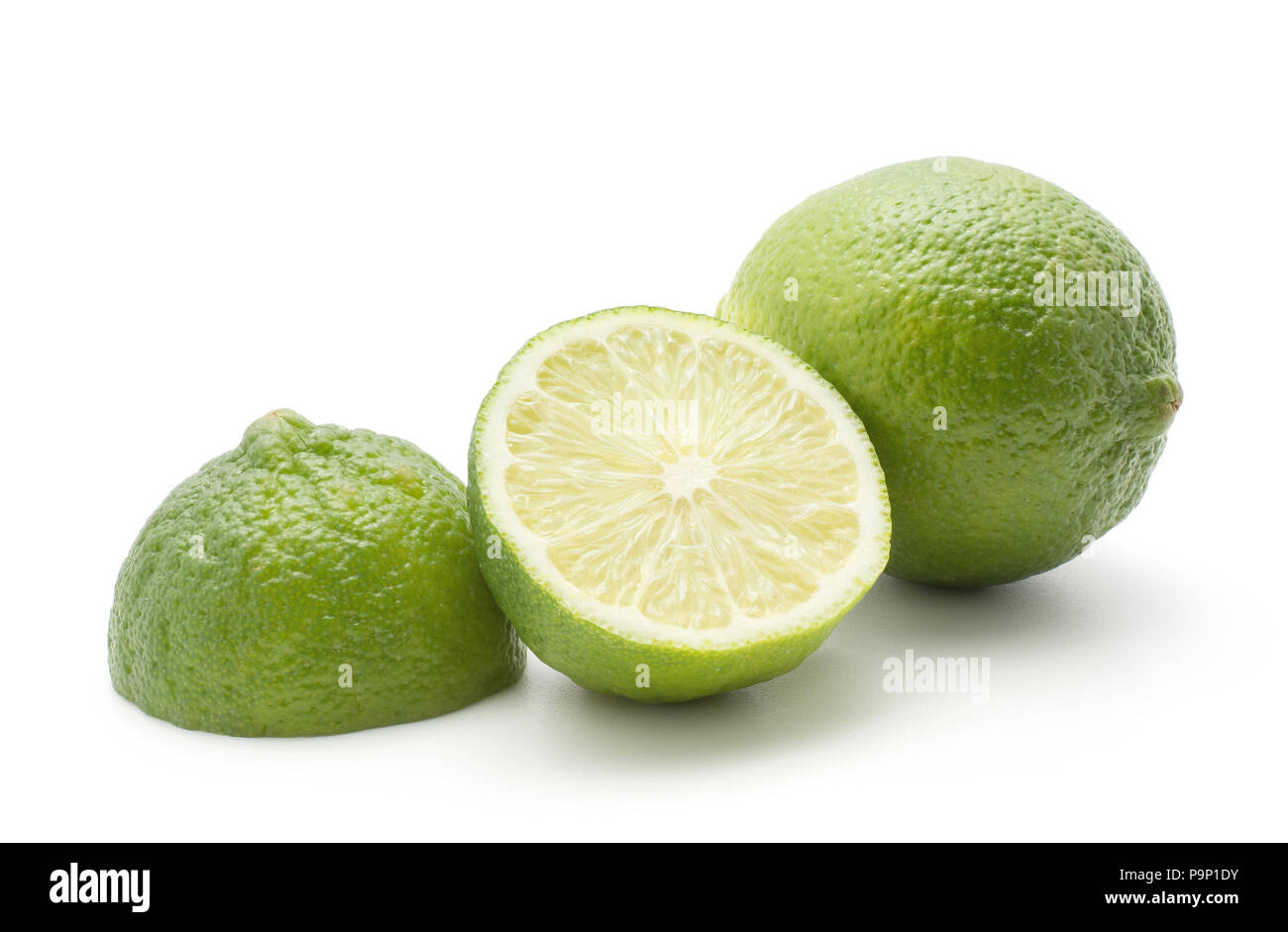 One lime two halves isolated on white background Stock Photo - Alamy