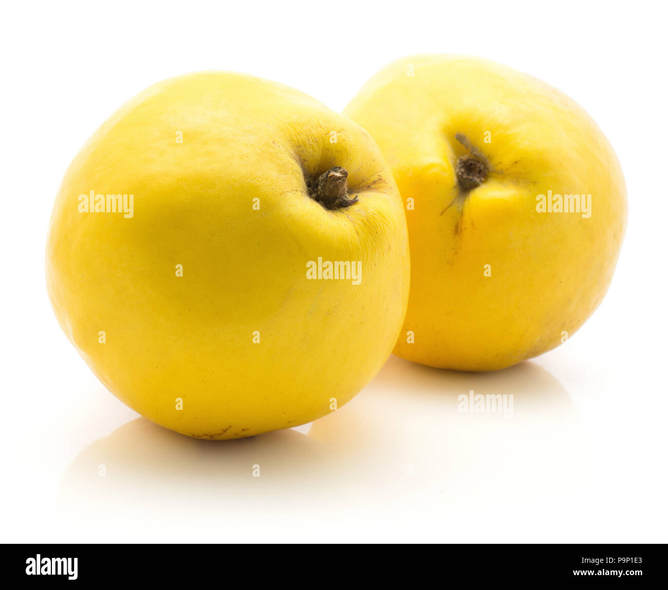 Two yellow quinces isolated on white background raw Stock Photo - Alamy