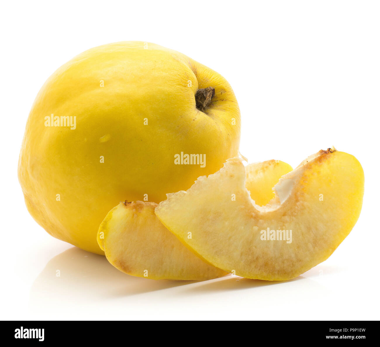One yellow quince with two slices isolated on white background raw ripe ...