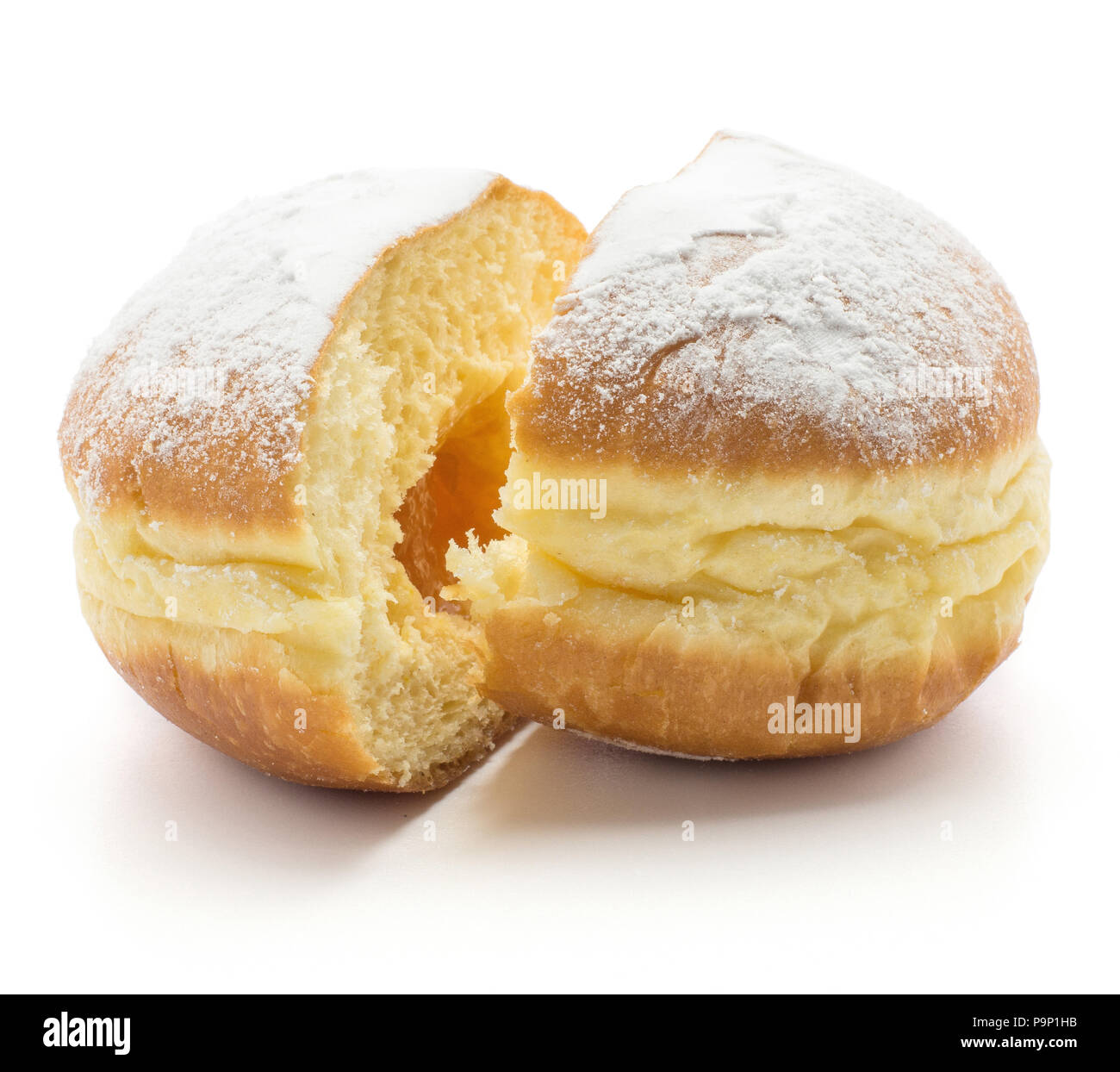 One doughnut (Sufganiyah) cut in half with apricot jam isolated on ...