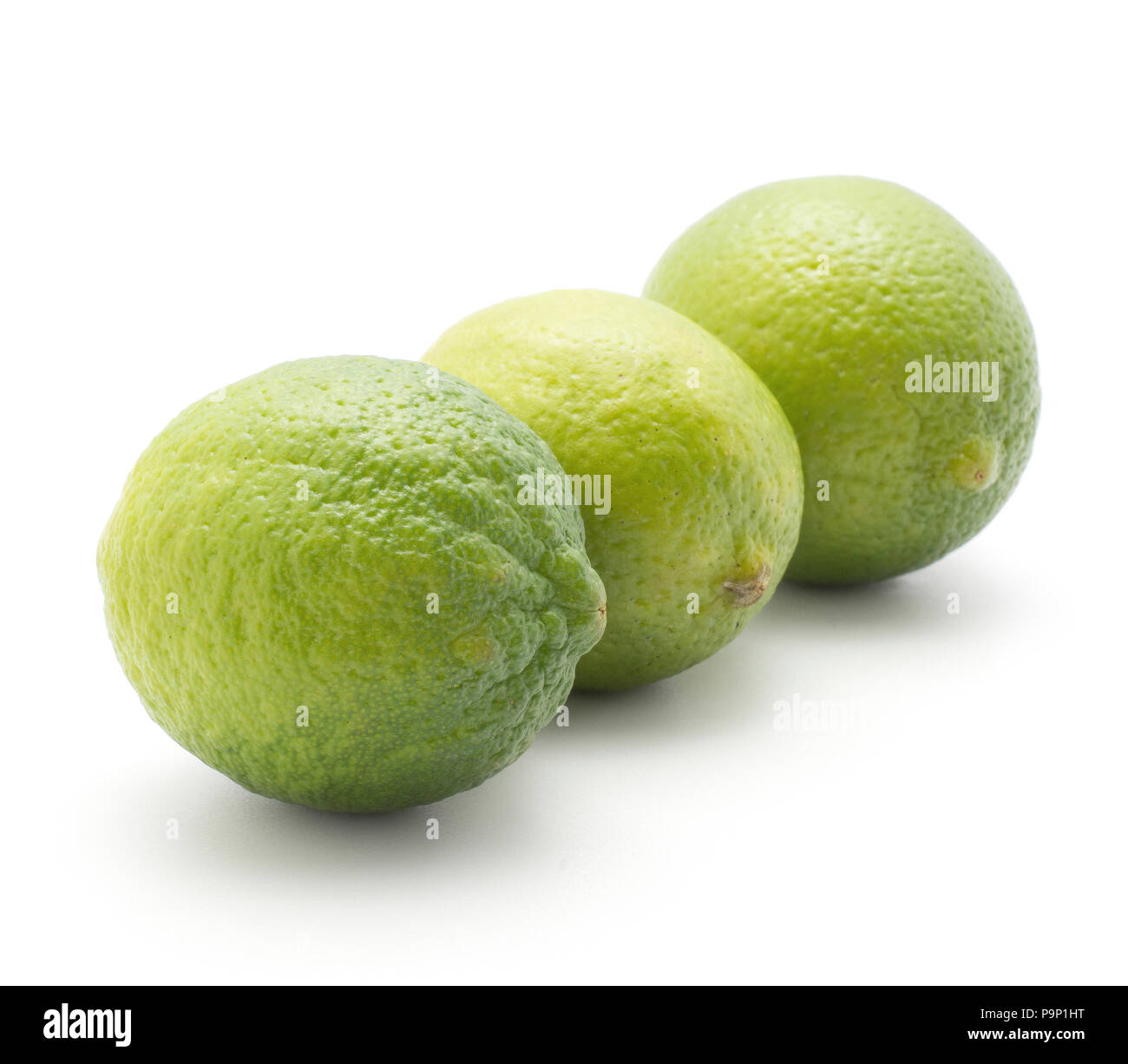 Three limes in row isolated on white background ripe and fresh Stock ...