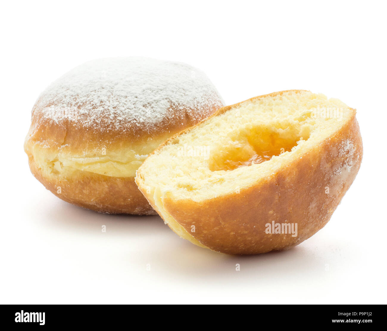 One doughnut (Sufganiyah) and one sliced half with apricot jam isolated ...