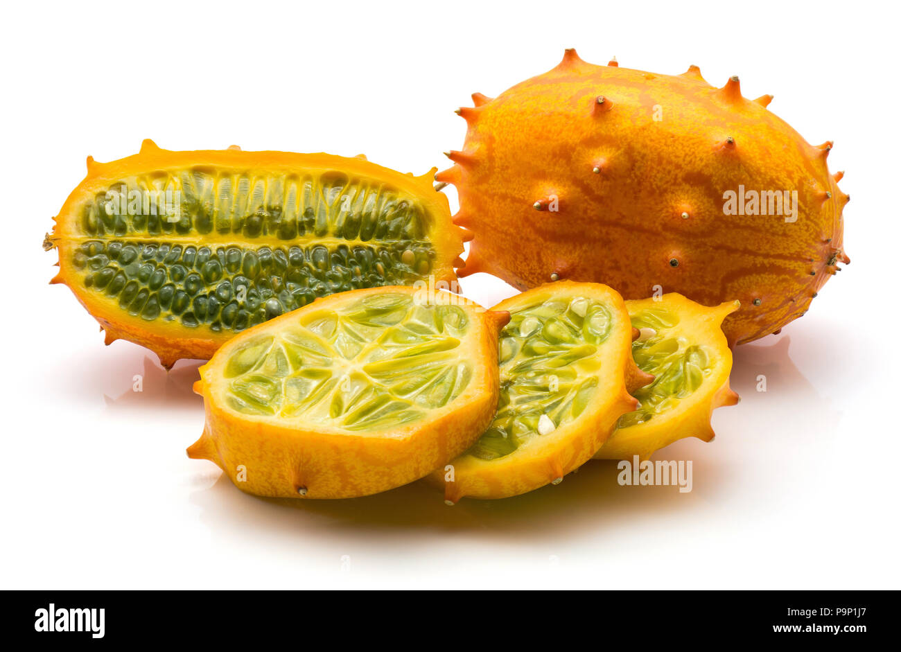 Sliced kiwano isolated on white background one whole one cross section ...