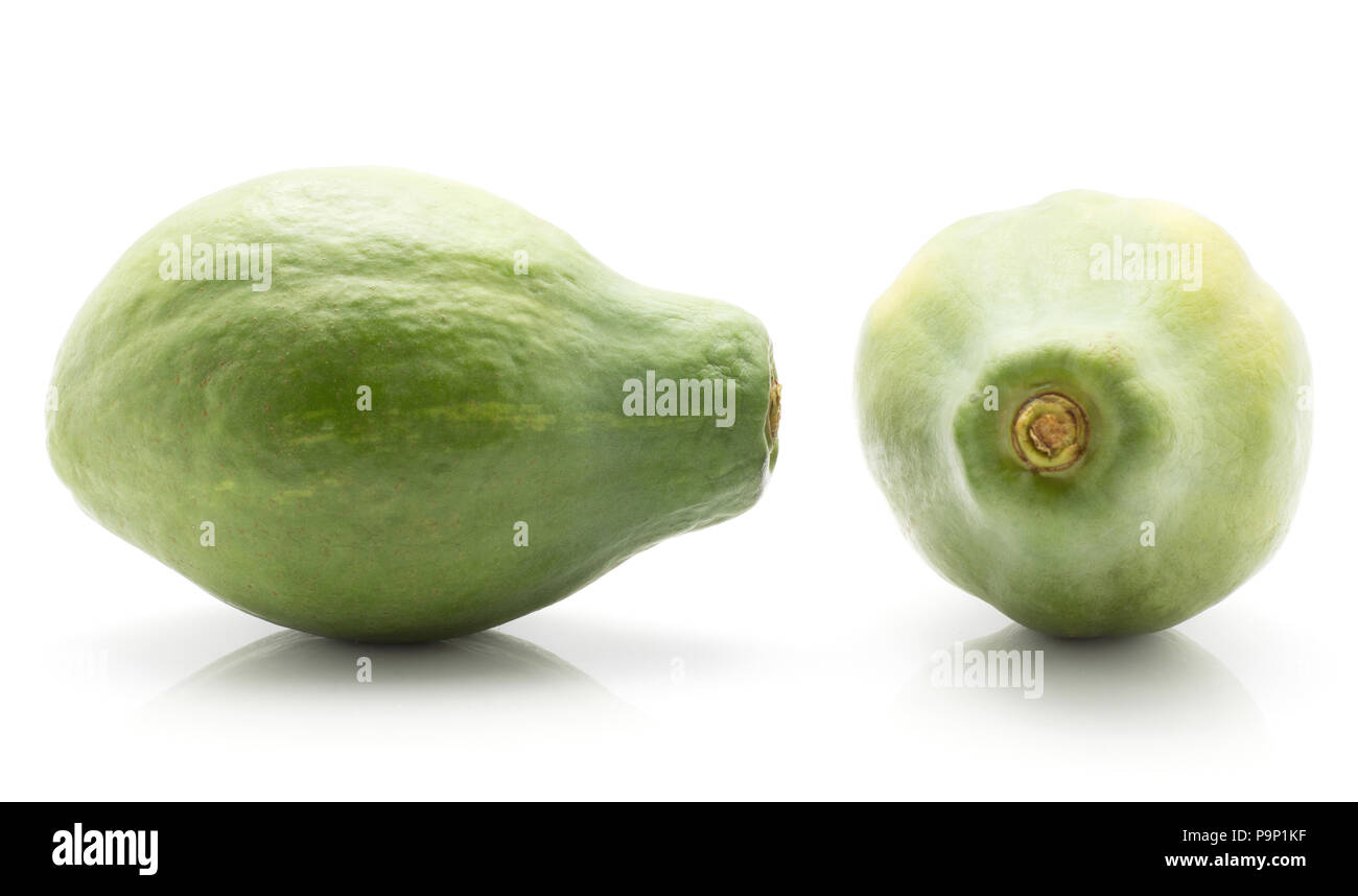 Two green papaya (pawpaw, papaw) isolated on white background top and ...