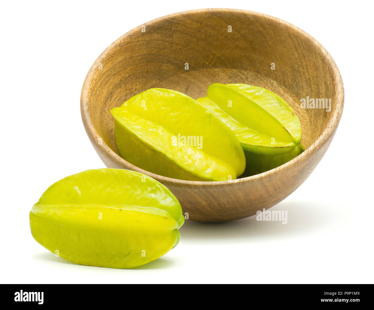 Fresh carambola in a wooden bowl isolated on white background Stock ...