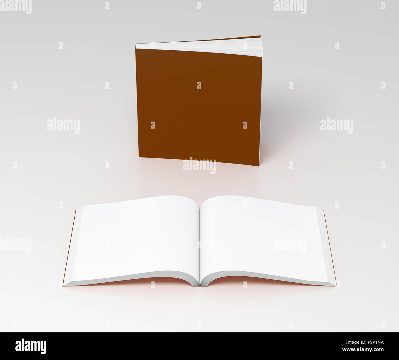 Blank brown square soft cover books open and standing on white ...
