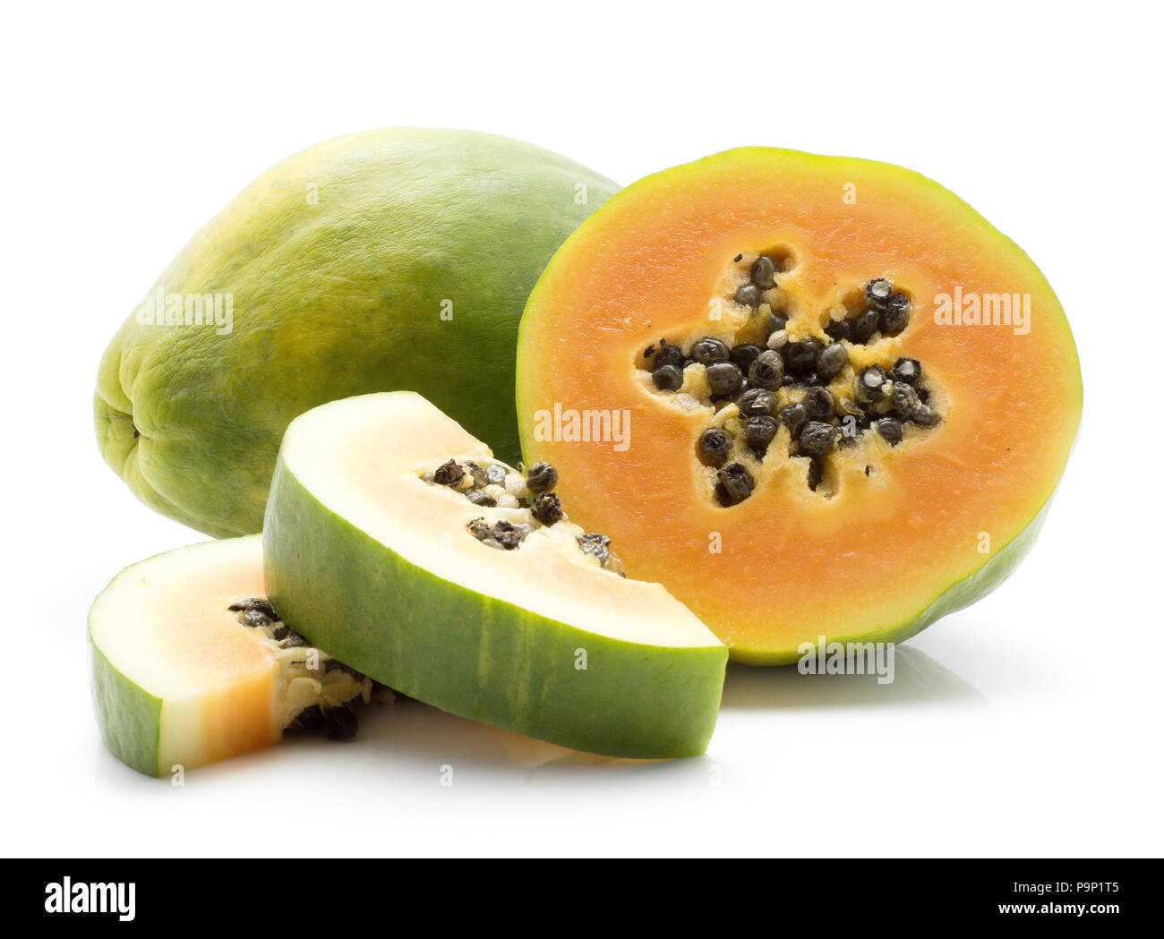Green papaya (pawpaw, papaw) one whole one half and two slices with ...