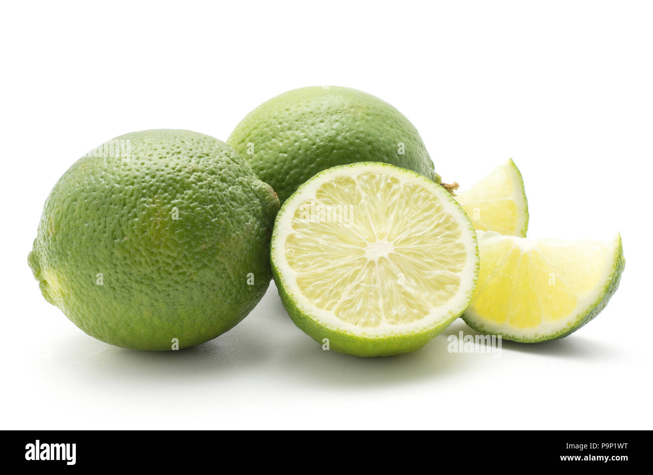 Lime set (two whole, one half, two slices) isolated on white background ...