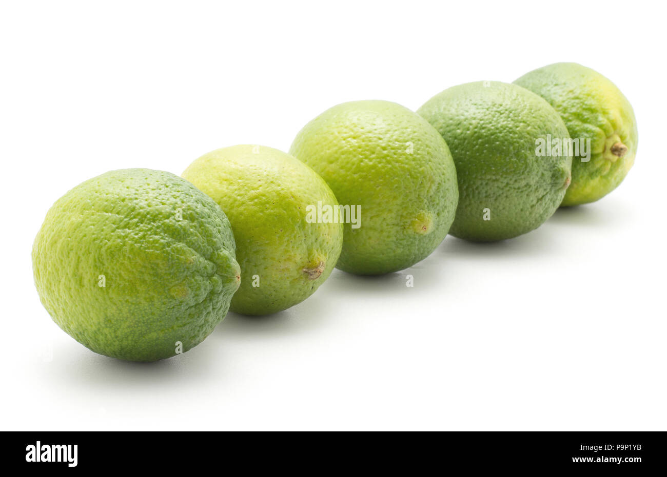 Five limes in row isolated on white background ripe and fresh Stock ...