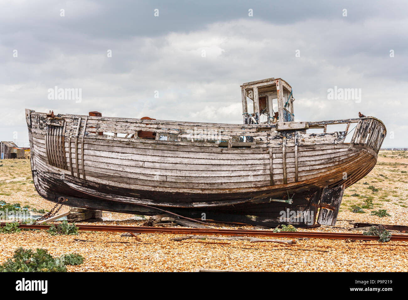 Hull of a rotting, disintegrating wooden fishing boat falling apart on ...