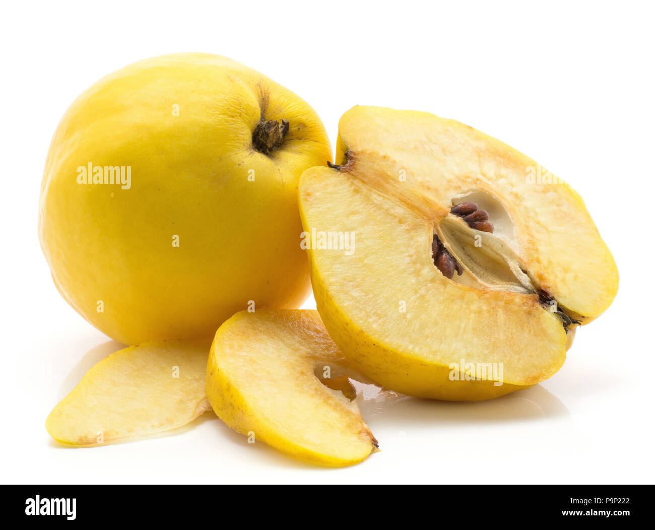 Yellow quince set one whole, half and two slices without seeds ...