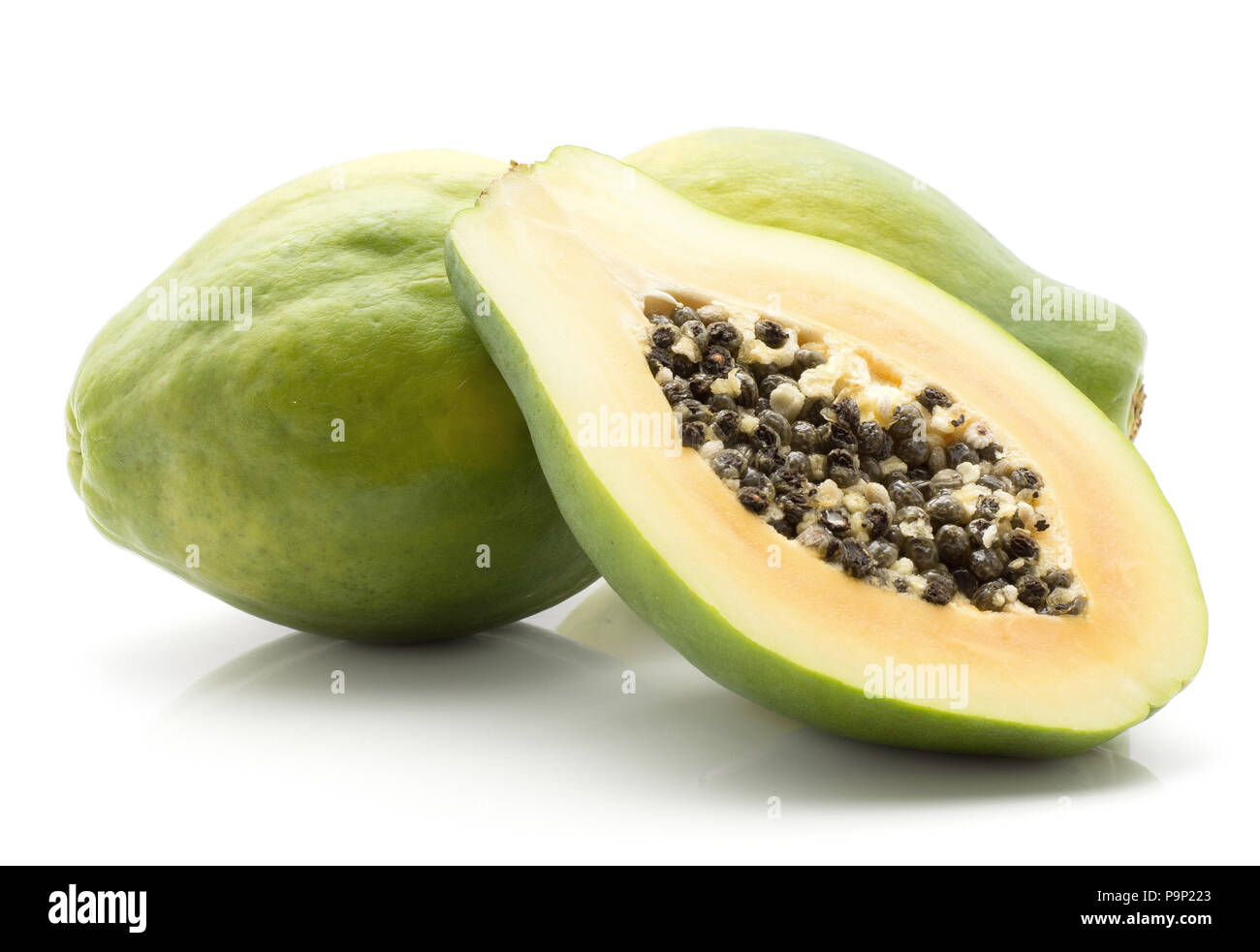 Papaya (pawpaw, papaw) isolated on white background two whole green and ...