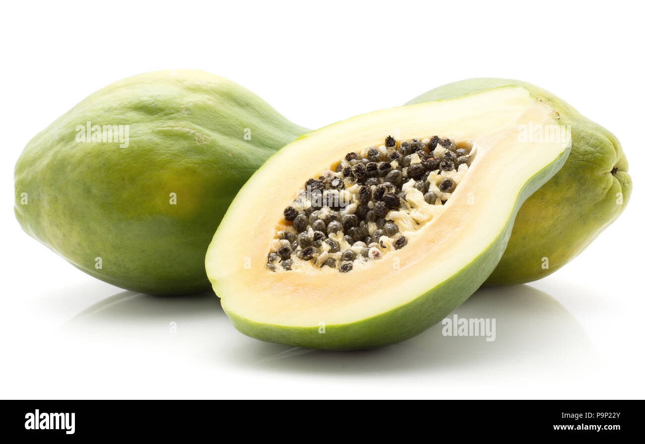 Papaya (pawpaw, papaw) isolated on white background two whole green and ...