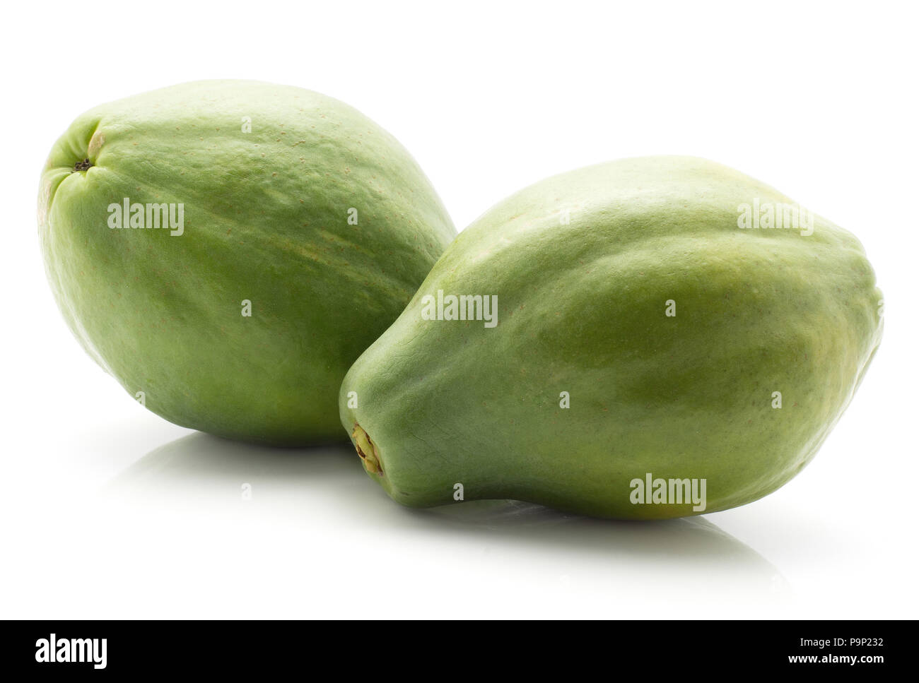 Two green papaya (pawpaw, papaw) isolated on white background Stock ...