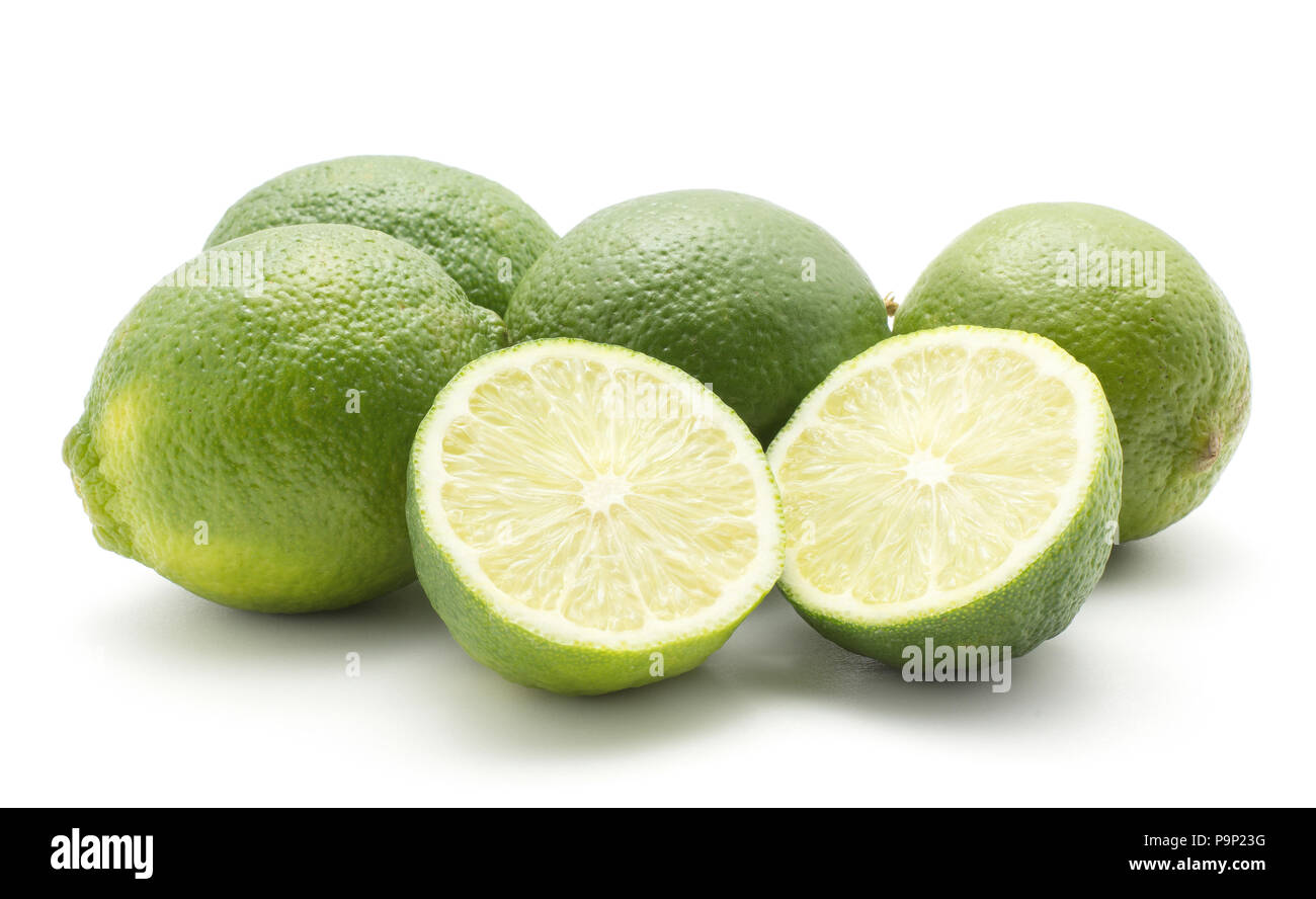 Lime stack four whole one cut in two halves isolated on white ...