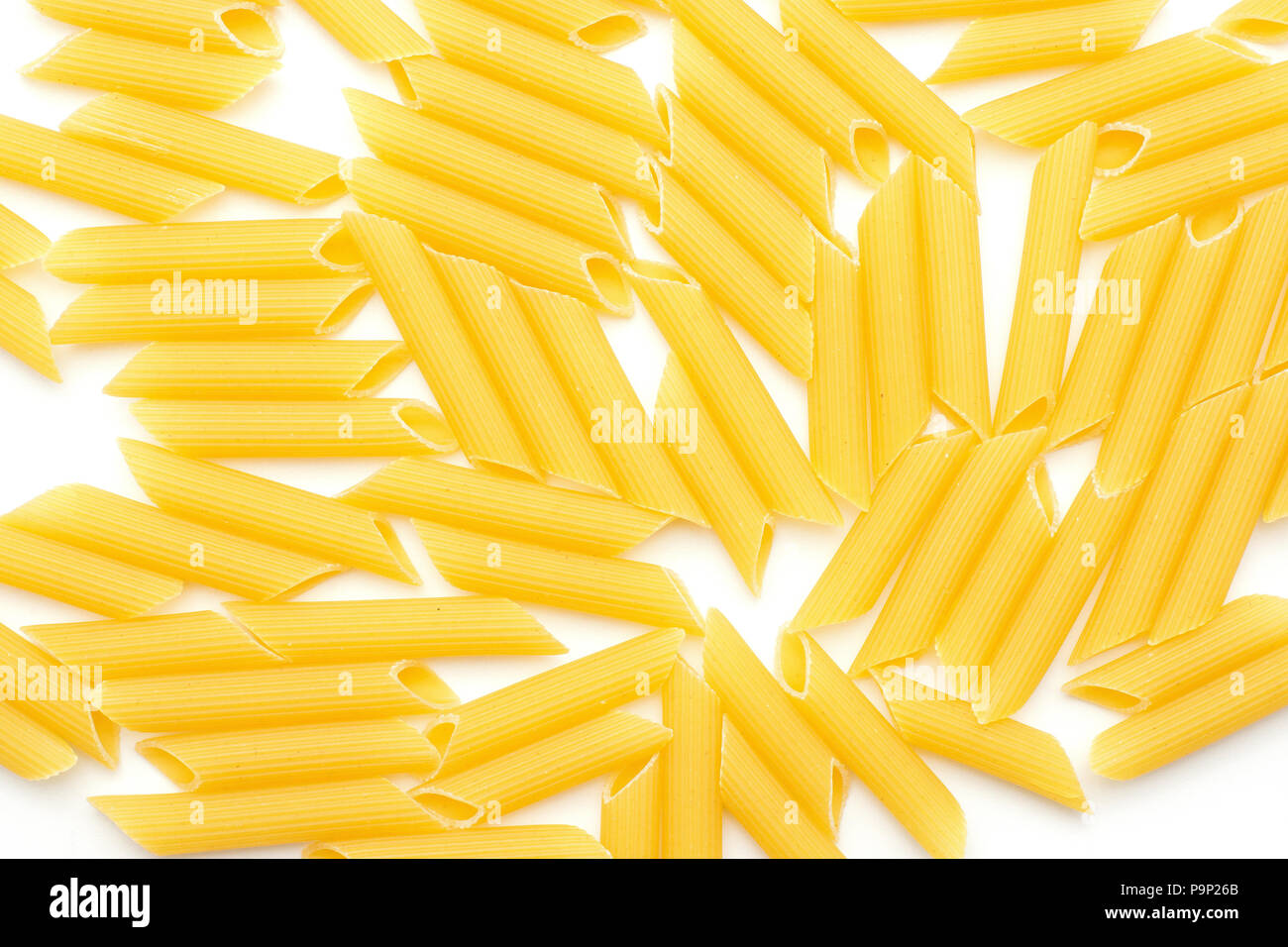 Penne rigate top view isolated on white background dry raw pasta pieces ...