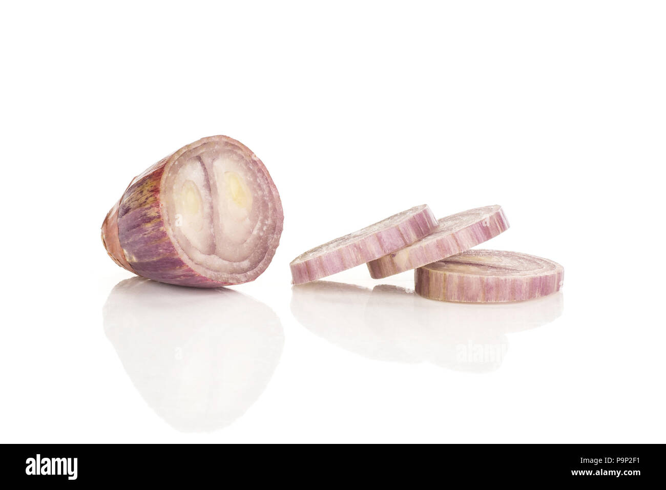 Sliced shallot one half and three ring slices isolated on white ...