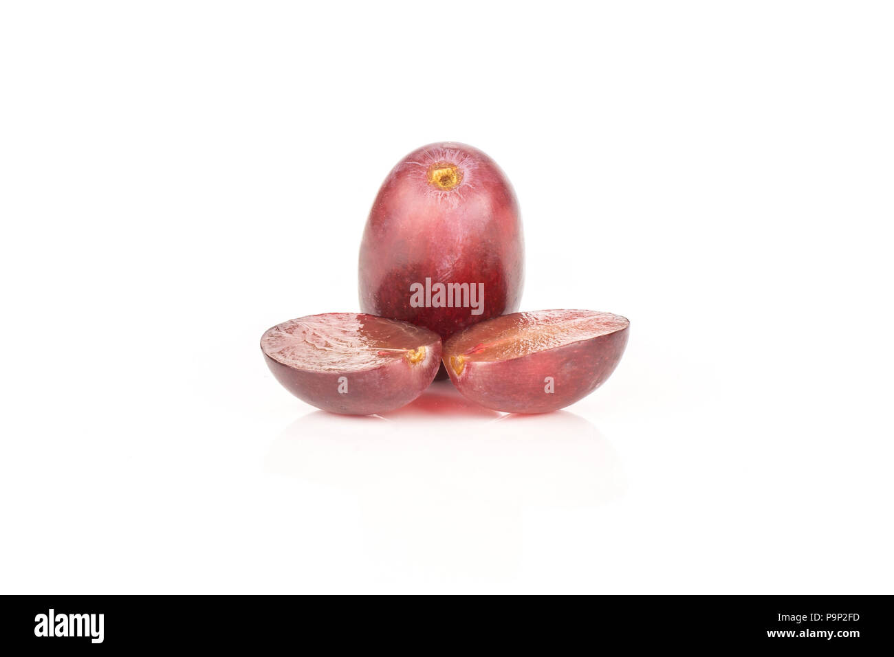 Sliced red globe grapes isolated on white background one whole berry ...