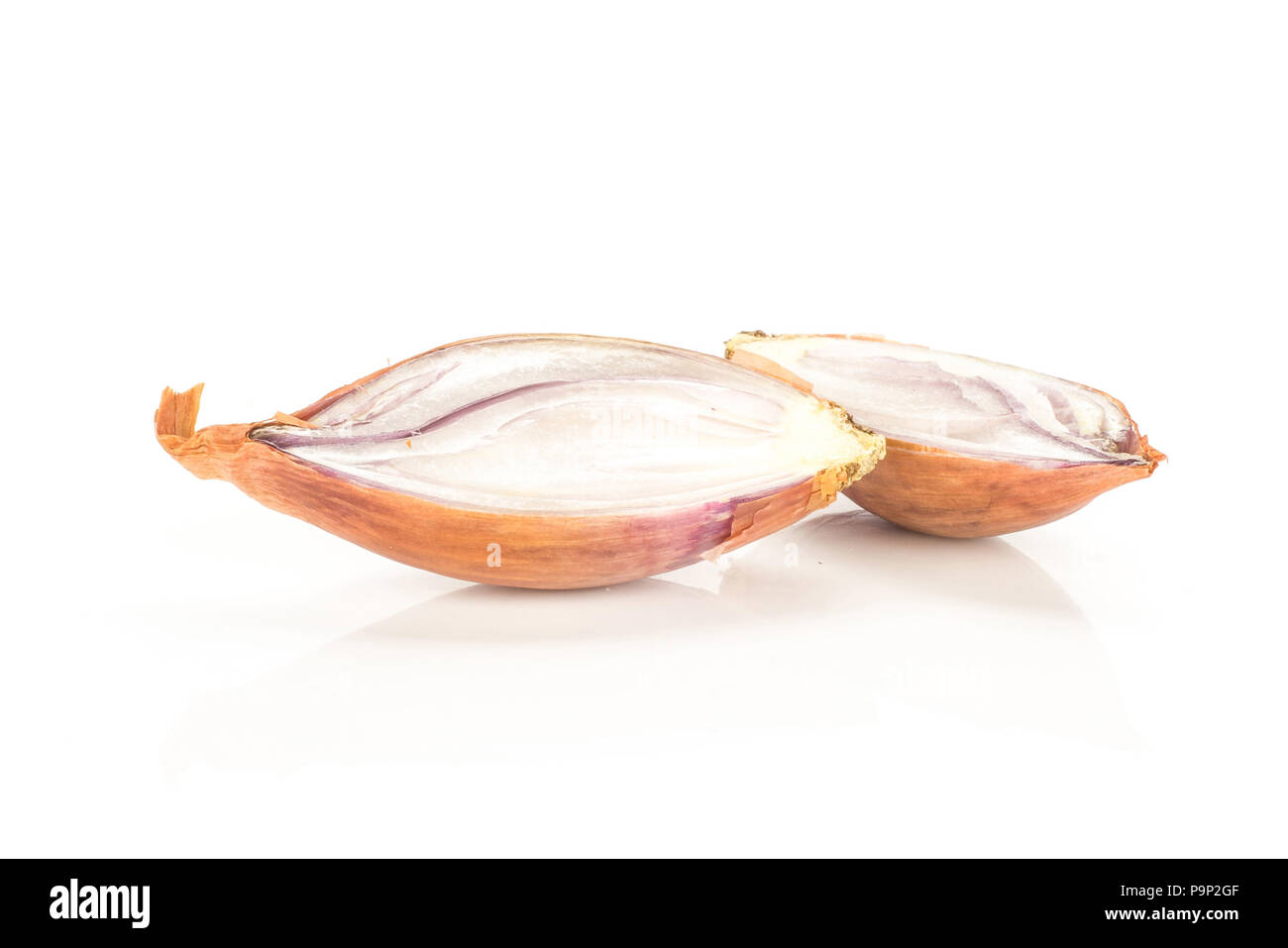 Two golden shallot halves isolated on white background Stock Photo - Alamy
