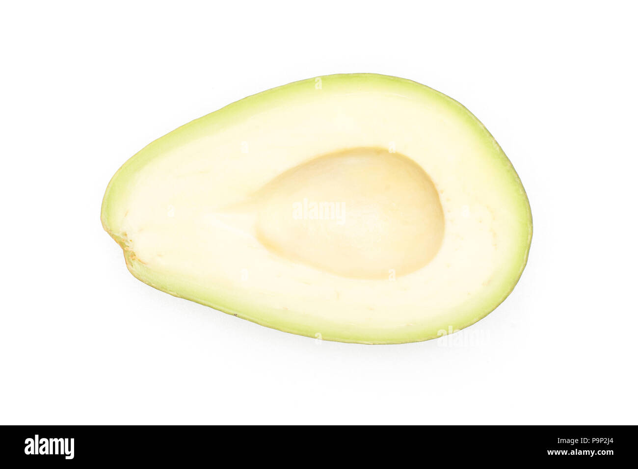 One green smooth avocado half without seed top view isolated on white ...