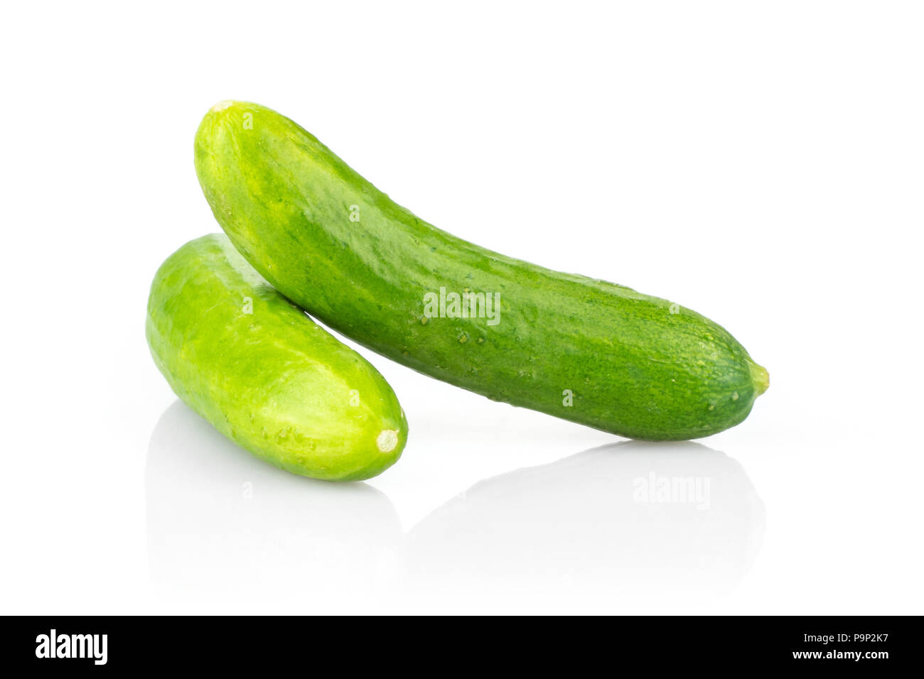 Two fresh green mini cucumbers isolated on white background Stock Photo ...