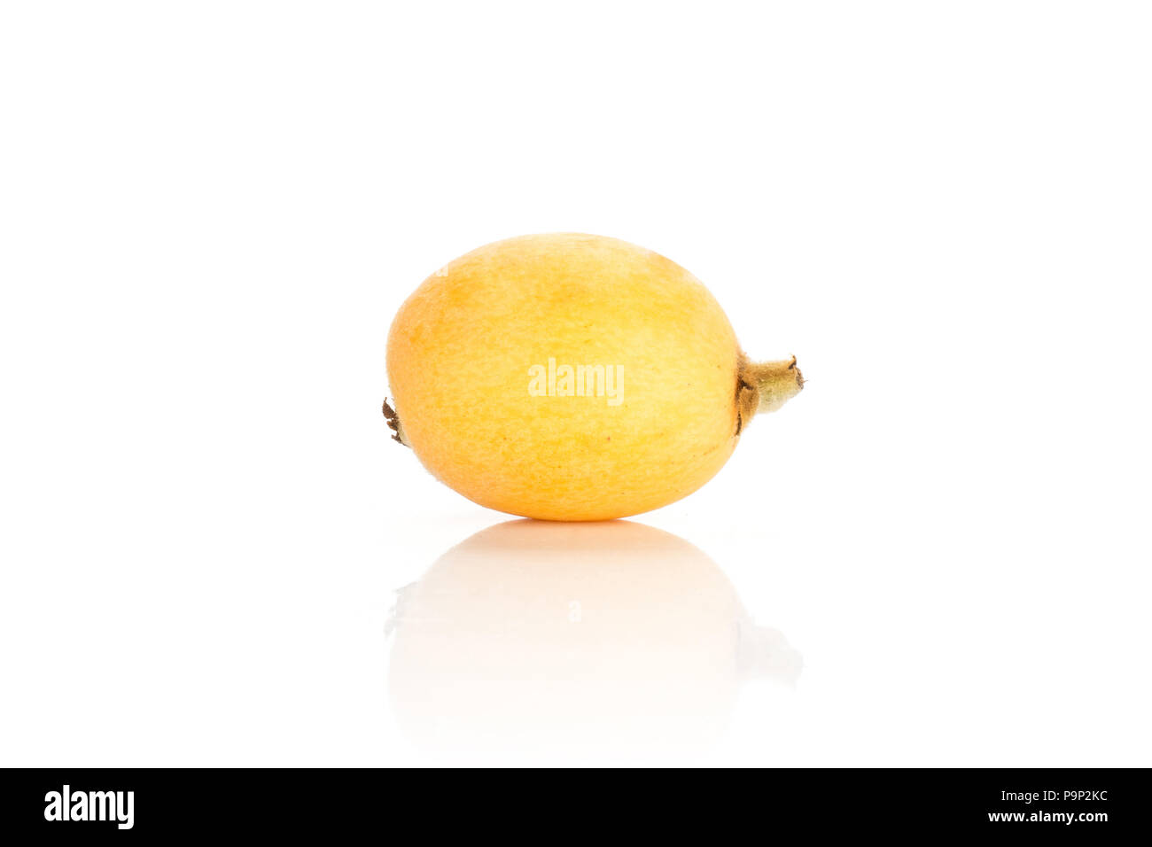 One fresh Japanese loquat isolated on white background ripe yellow ...
