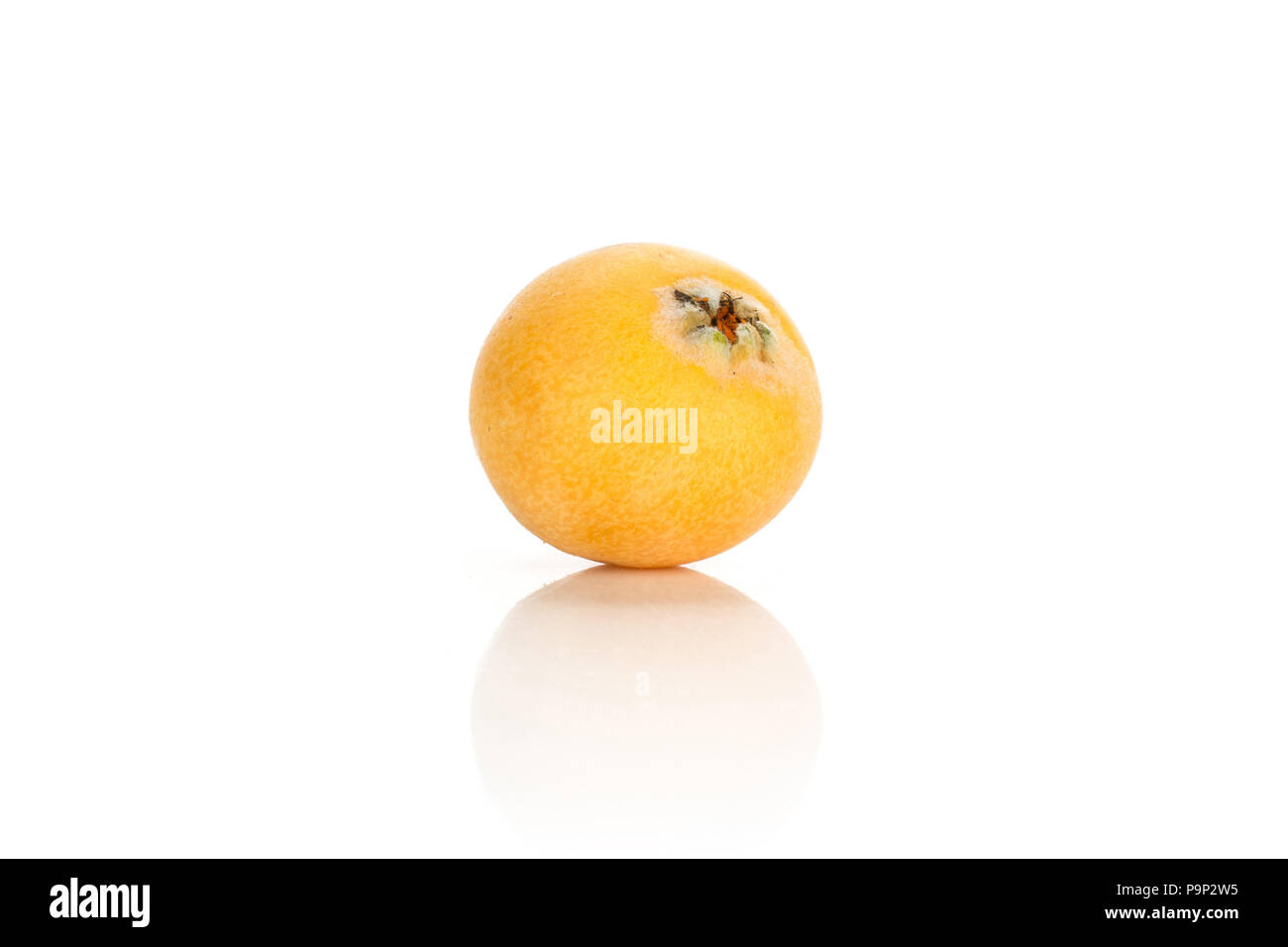 One fresh Japanese loquat isolated on white background yellow Stock ...