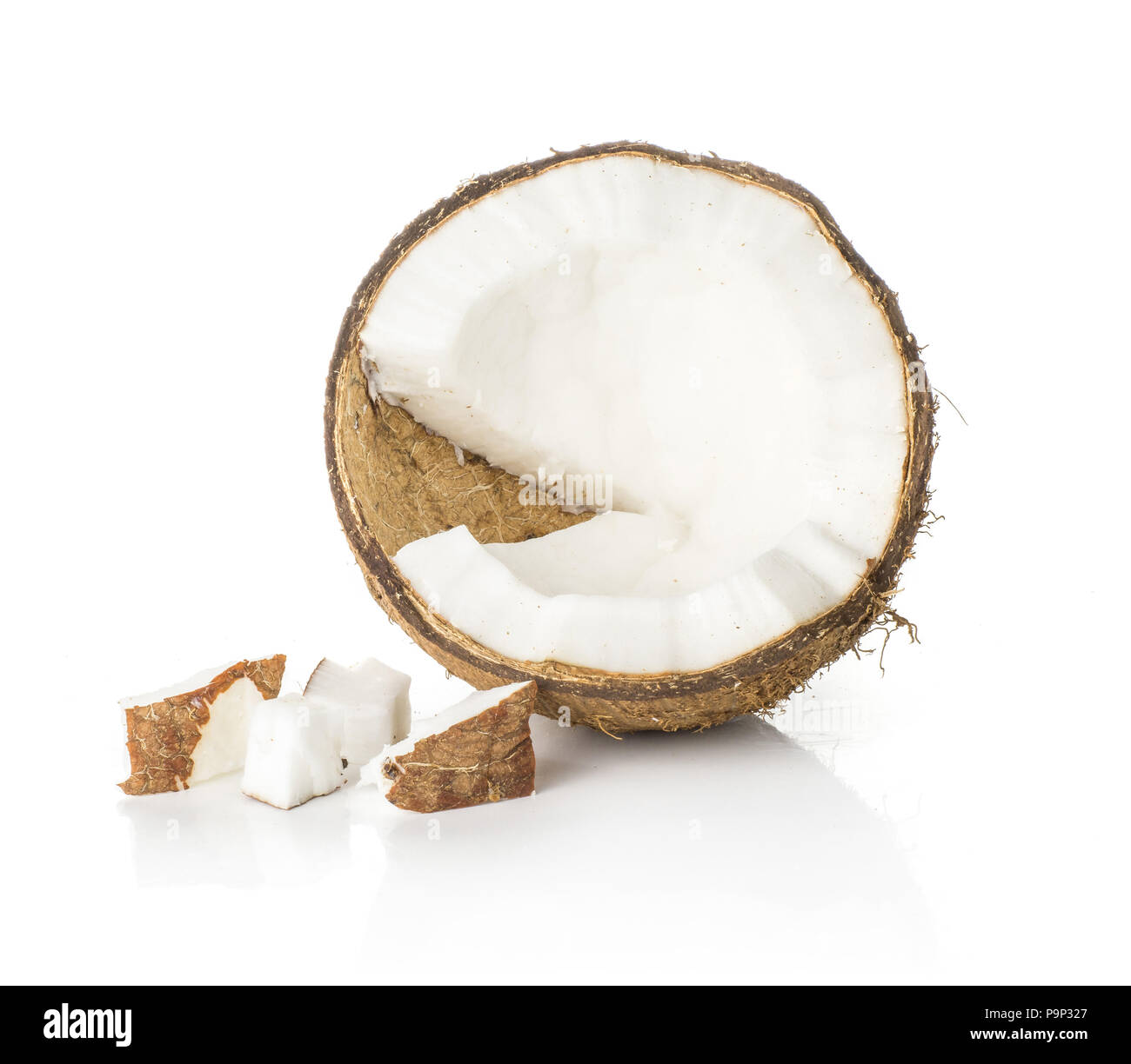 One coconut half with three pieces isolated on white background brown ...