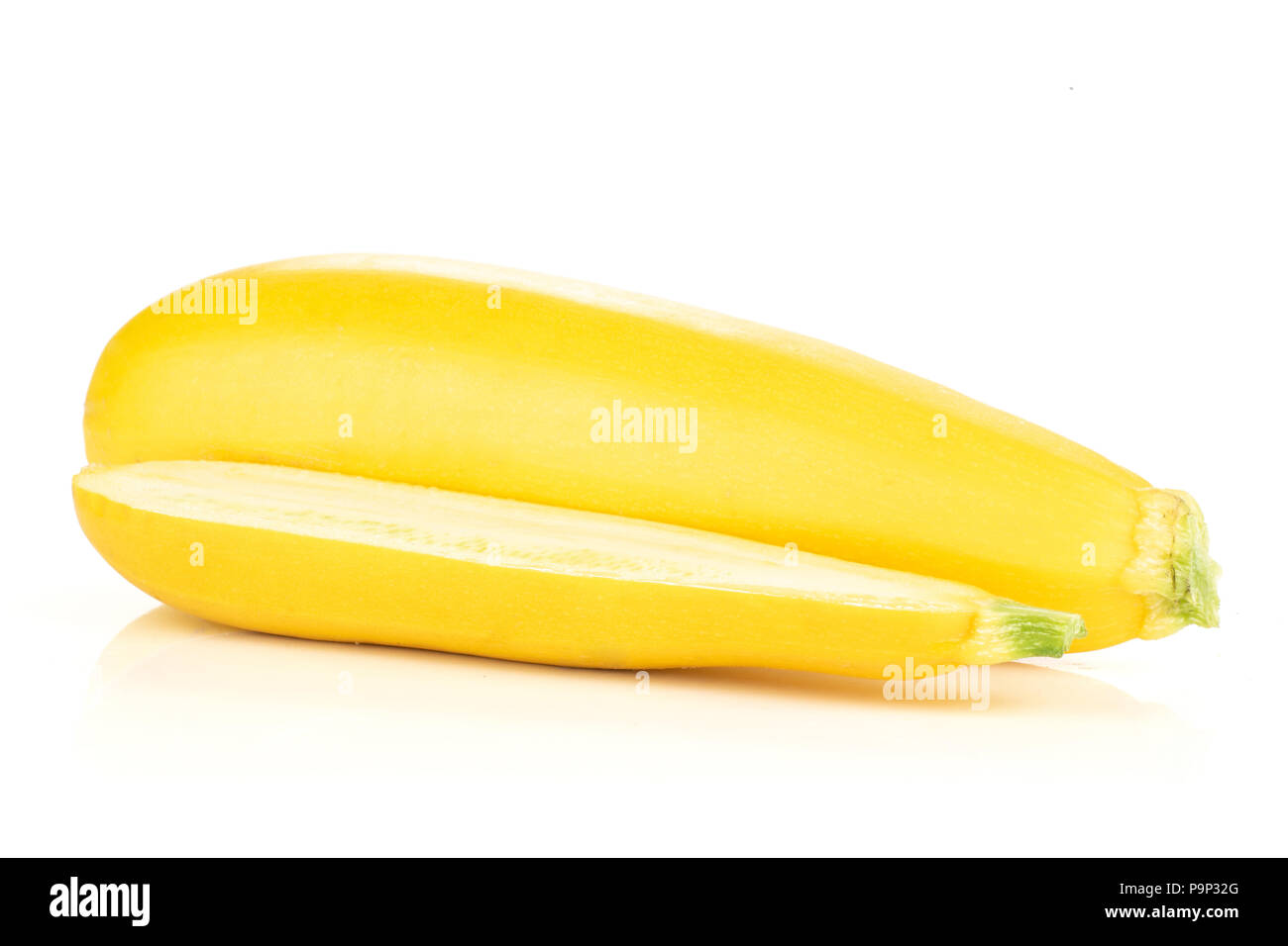 Group of one whole one half of raw yellow zucchini isolated on white ...
