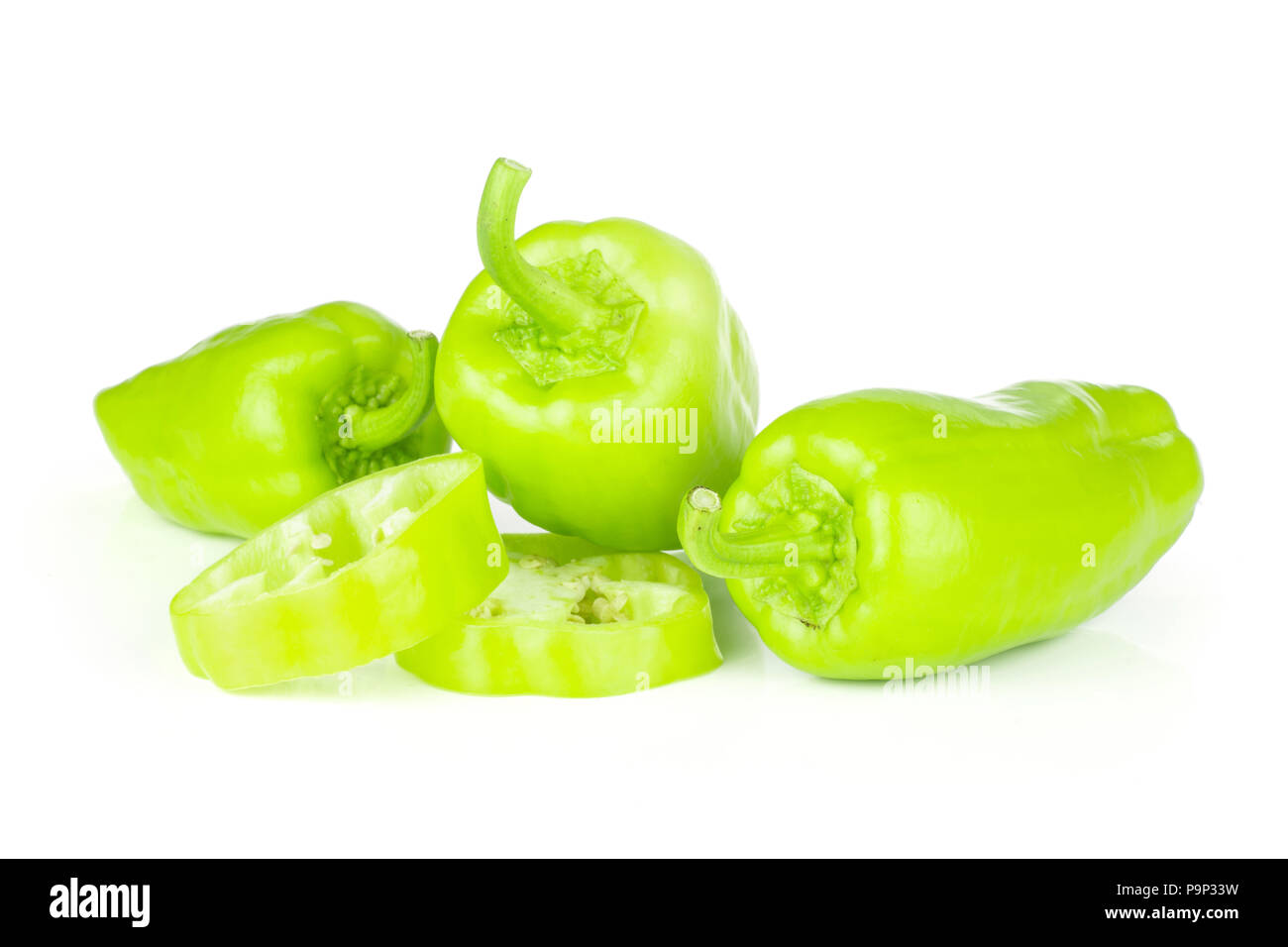 Group of three whole two slices of light green bell pepper isolated on ...