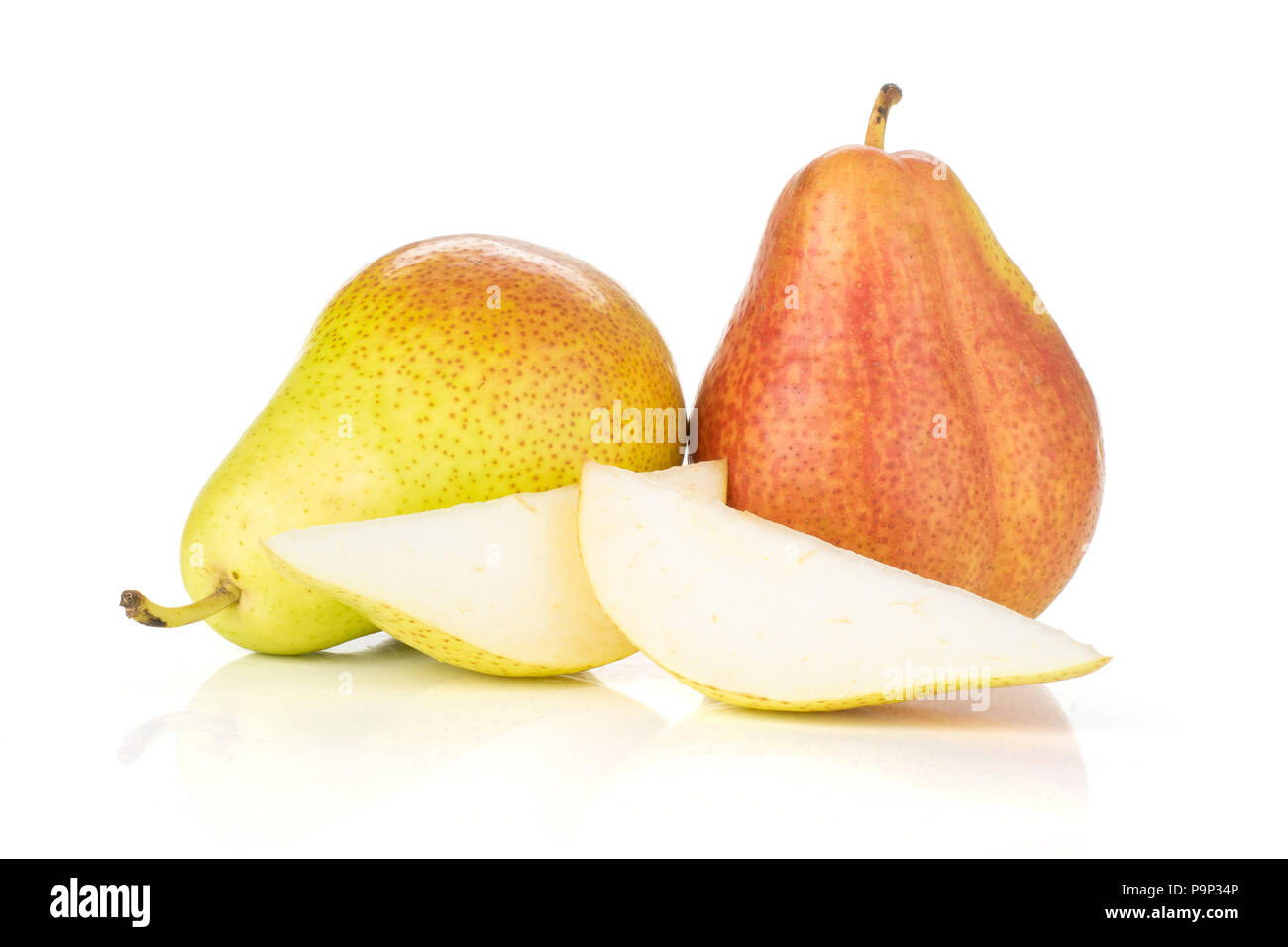 Group of two whole two slices of fresh red pear forelle variety ...