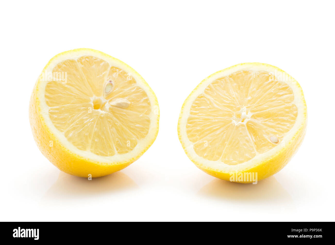 Two lemon halves isolated on white background one yellow lemon cut in ...